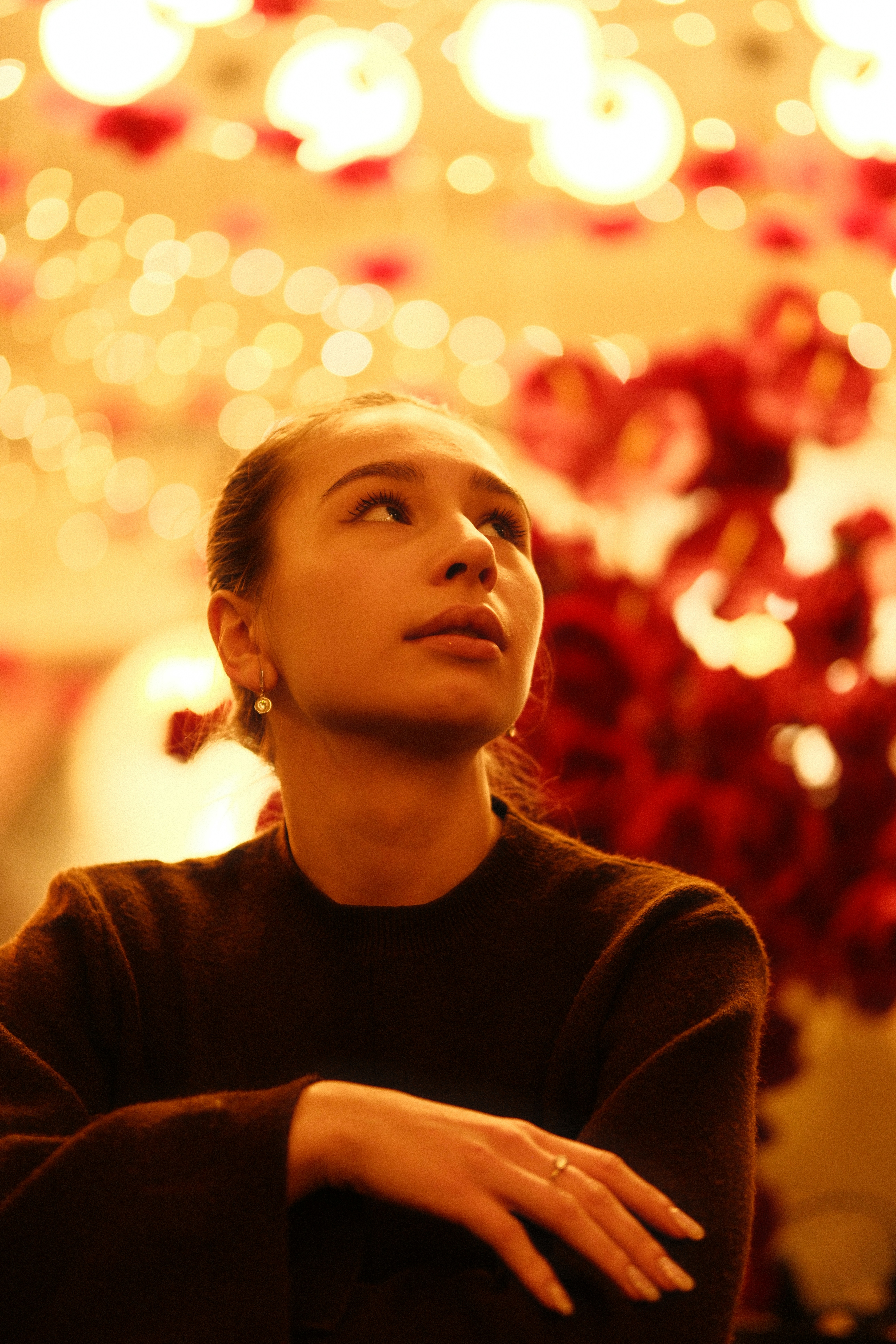 Softly Lit Gaze: A Portrait in Warm Bokeh