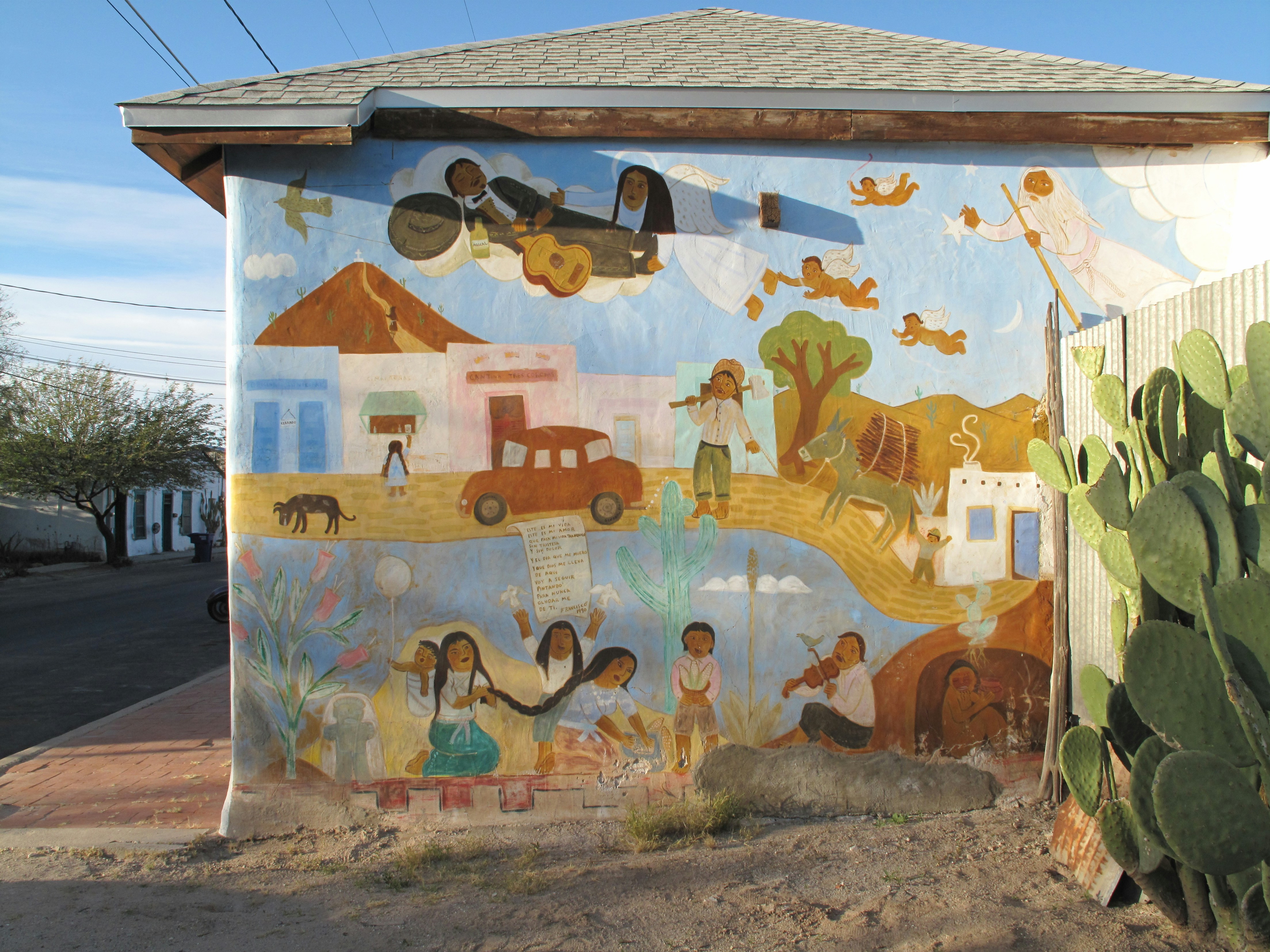 Colorful mural depicting desert life and people