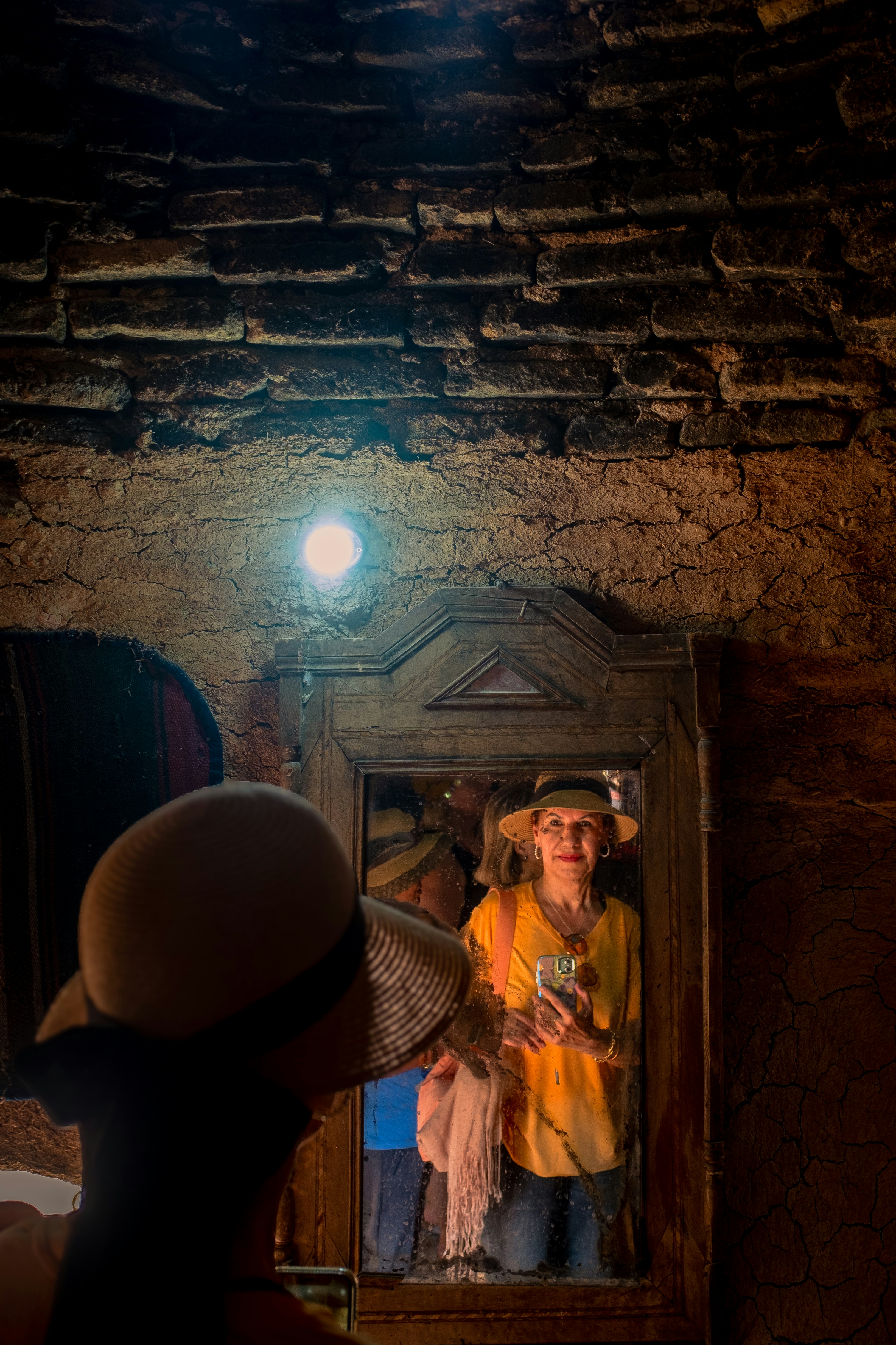 Reflective Portrait in a Cracked Mirror Corridor