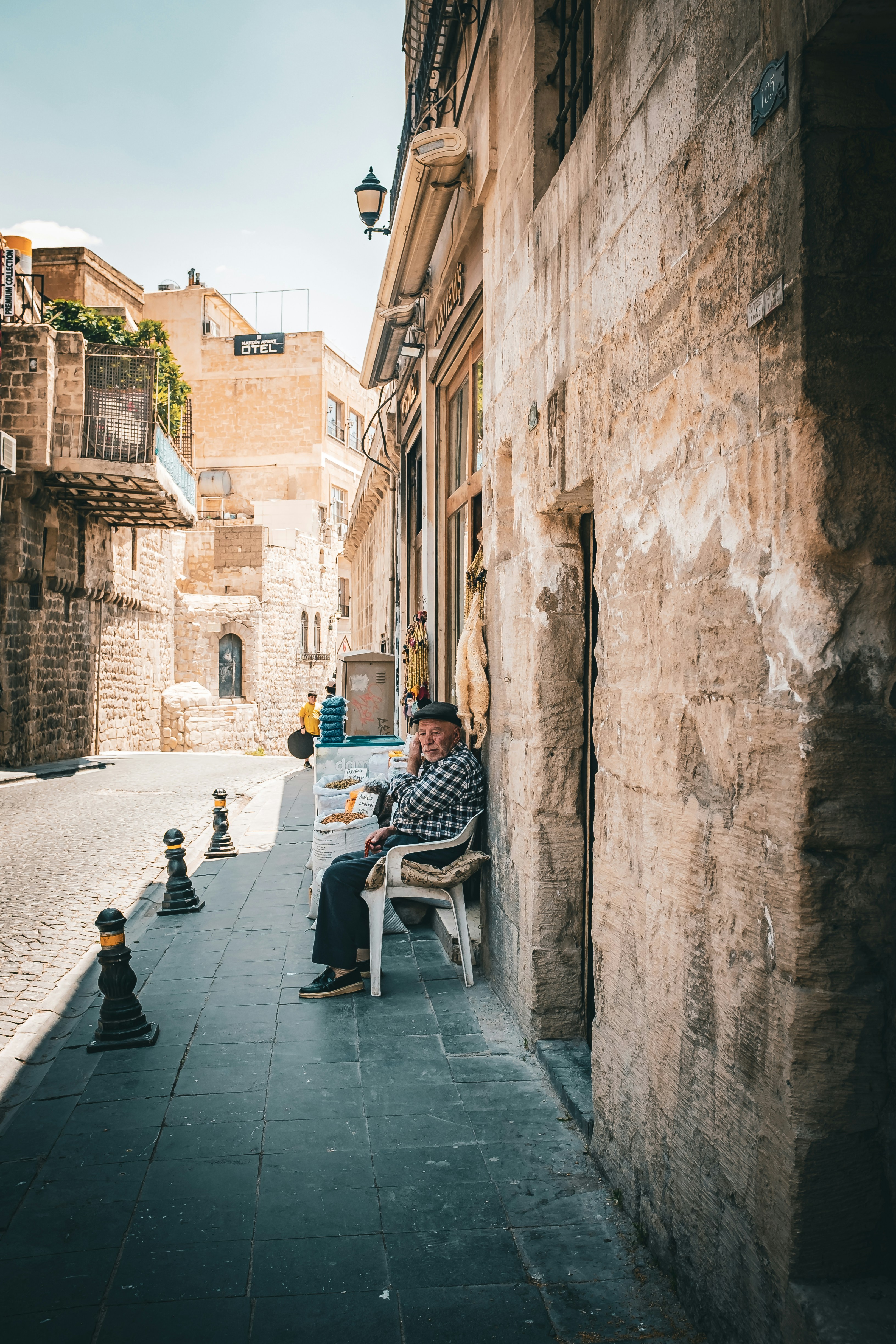 Sunlit Street Chair: A Quiet Moment in Old Town Shade