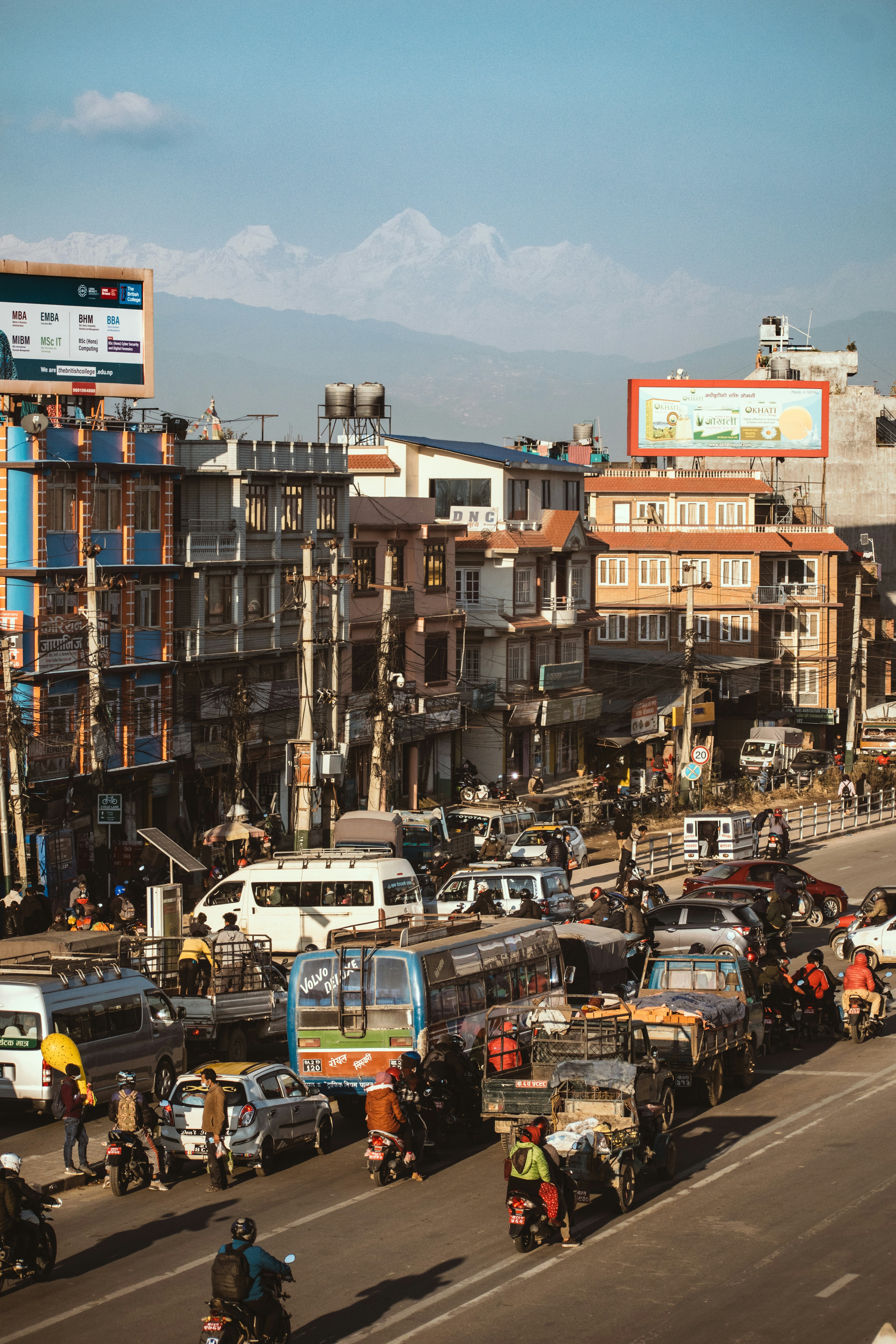 City Clash: A Busy Street of Buses, Cars, and Motorbikes