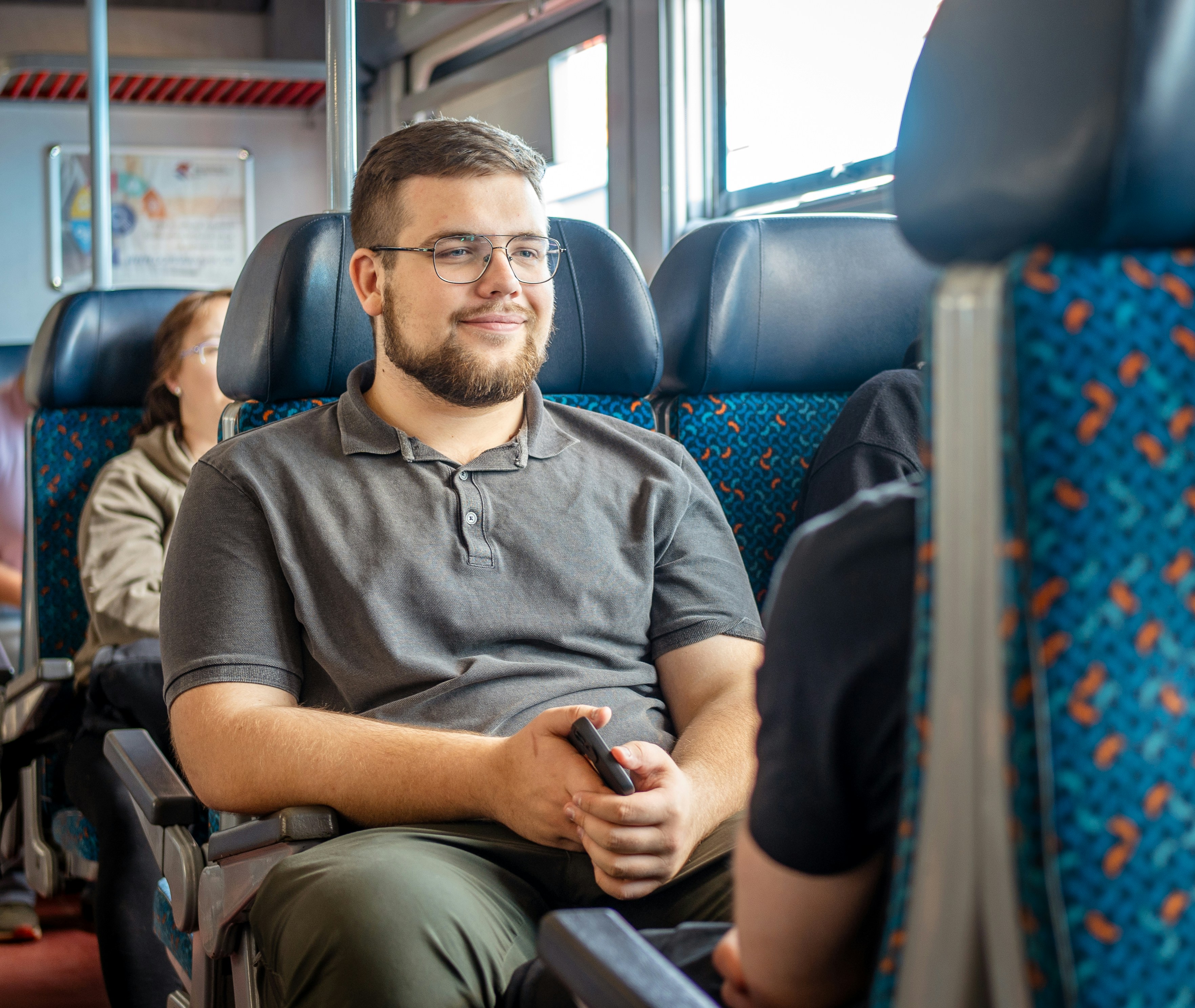 Passenger in a Quiet Moment: A Bus Ride with Focused Calm