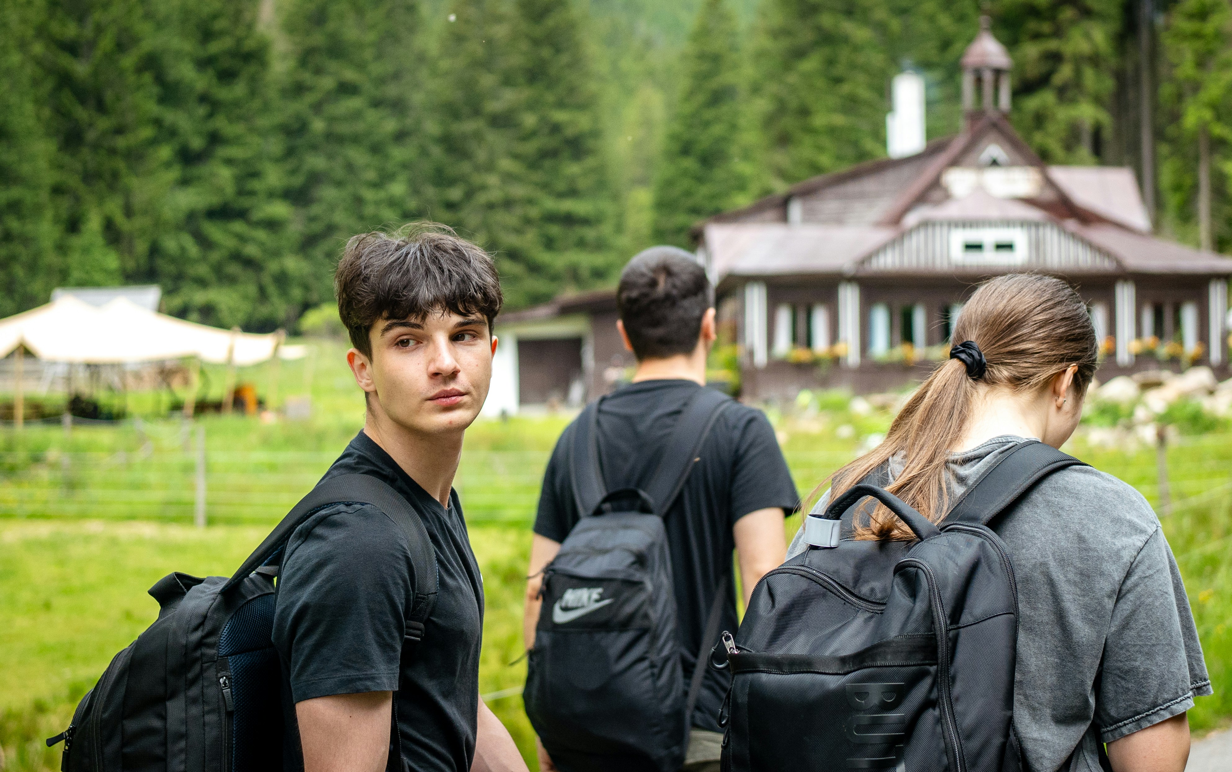 Youth in the Meadow: A Moment Before the Hike