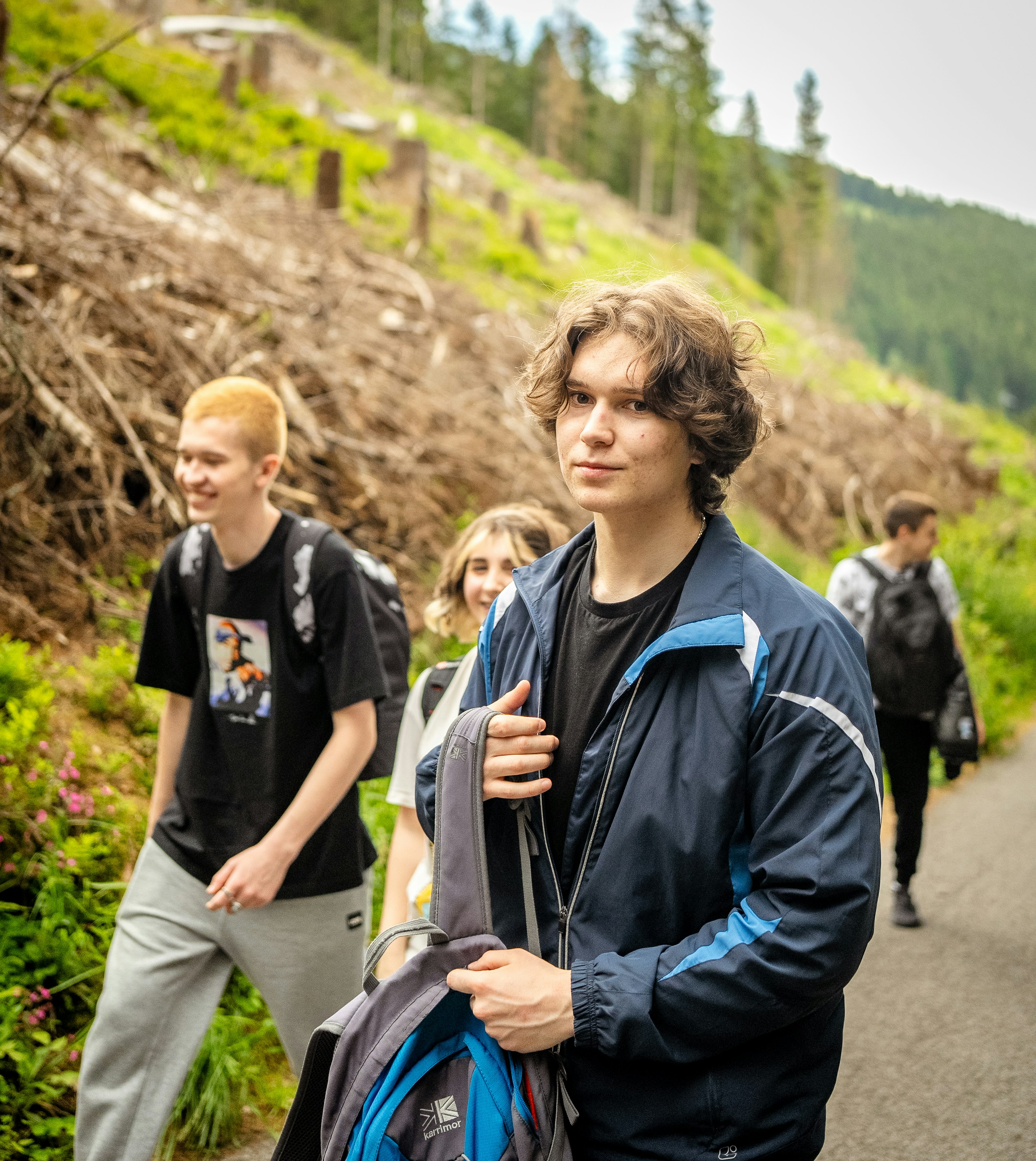 Mid-Stride Pause: A Quiet Moment Among Friends on the Hiking Trail
