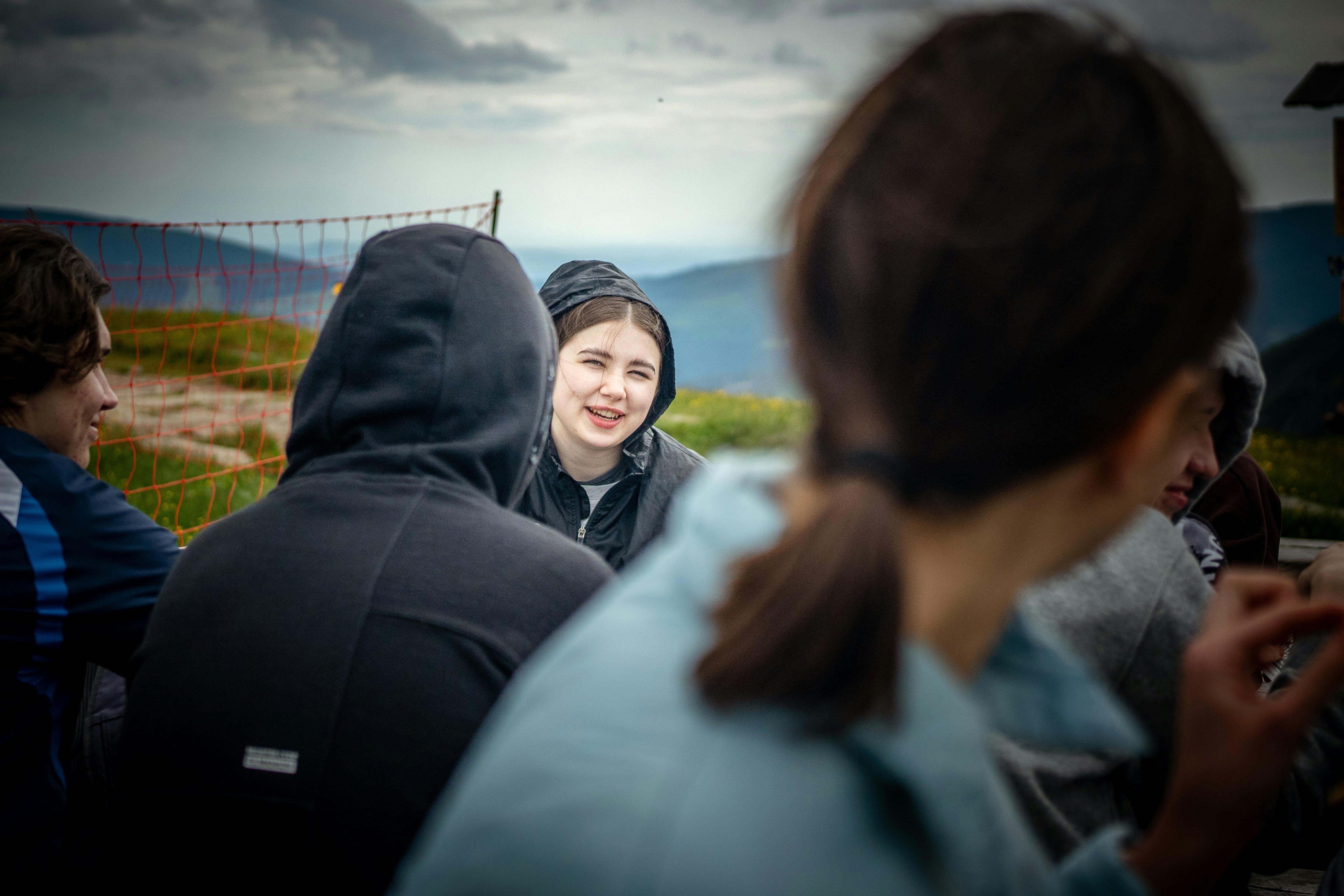 Soft Confidences on a Hilltop Gathering