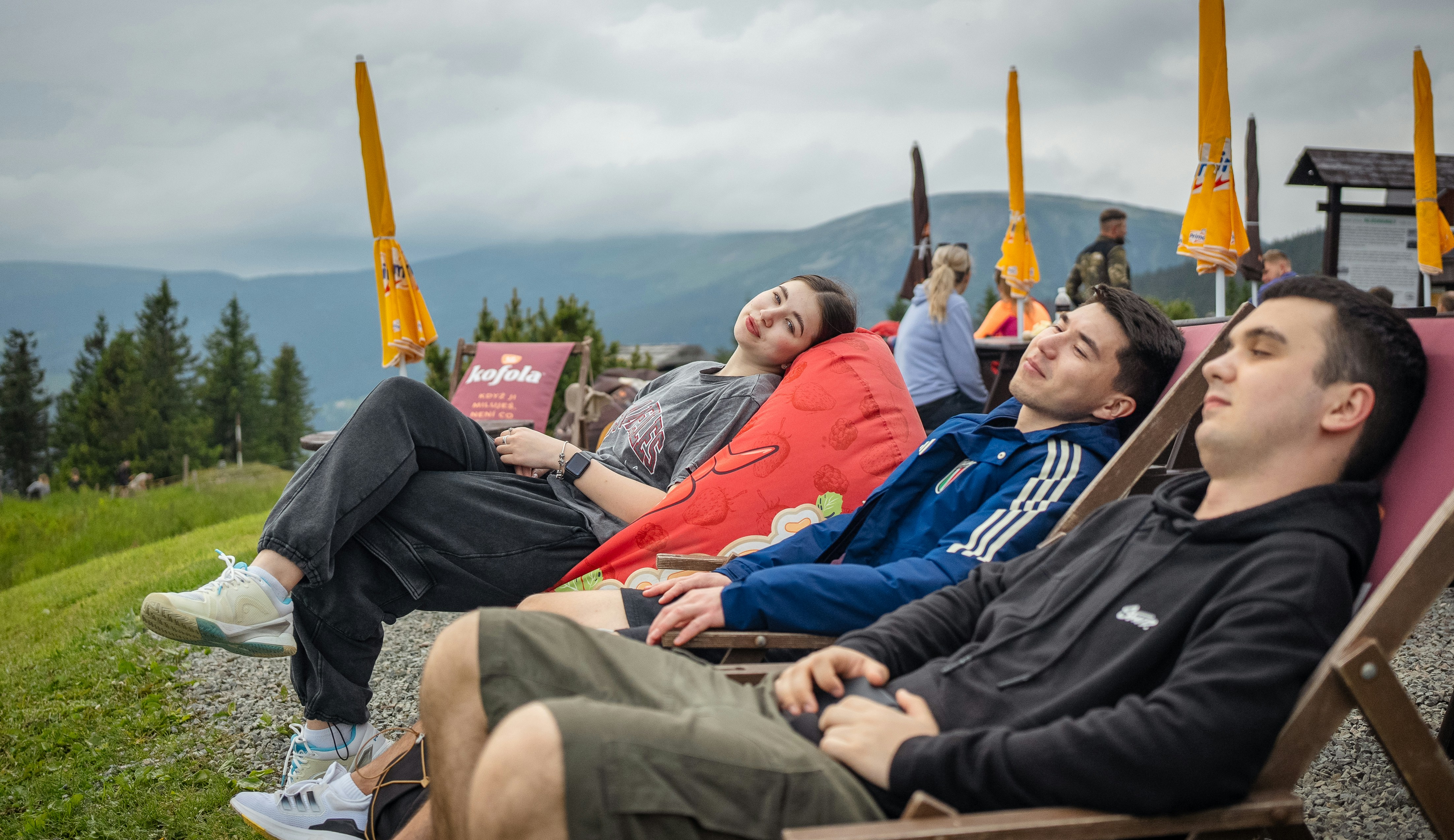 Sunlit Repose on the Slope: Friends Soak Up the View