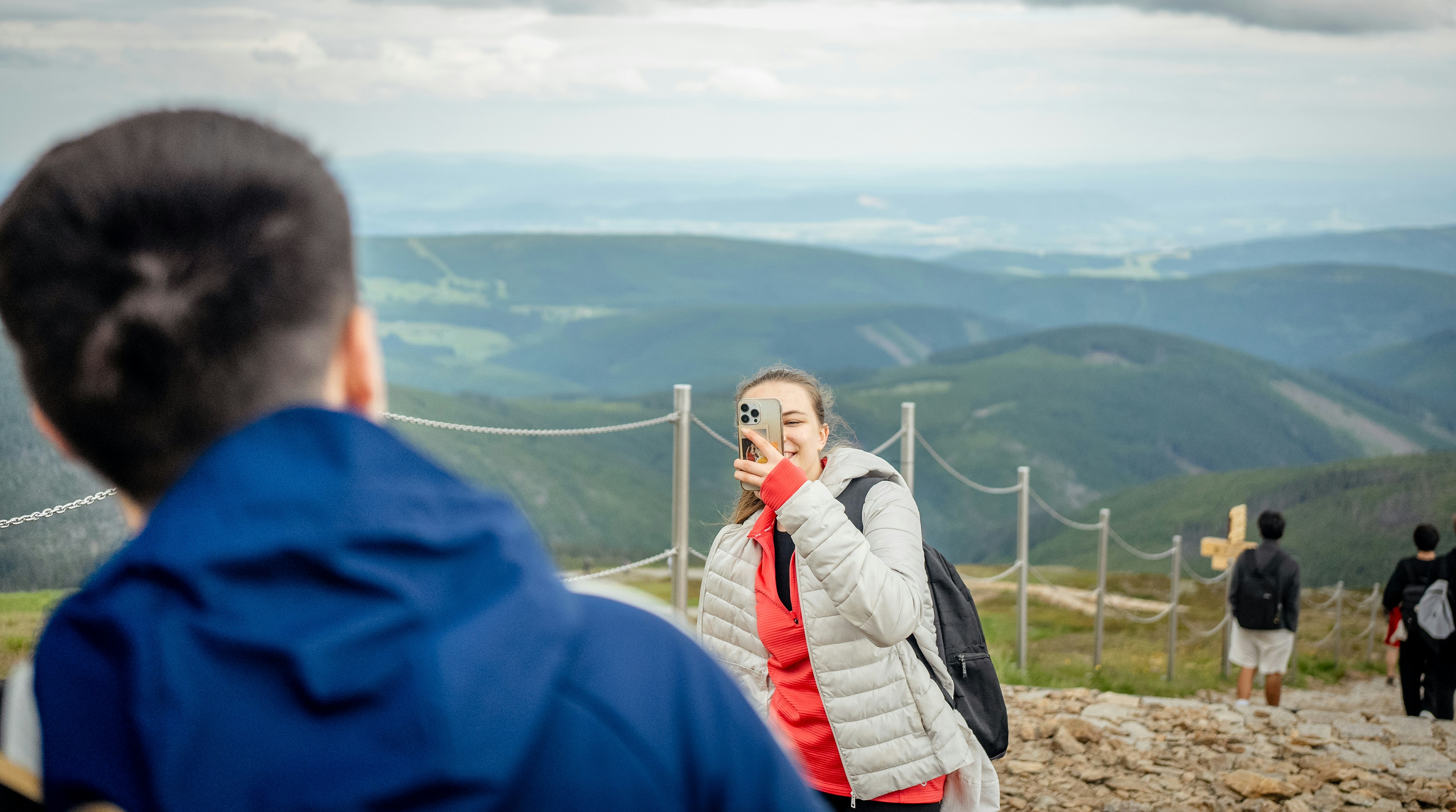 Selfie at the Summit: Traveler Captures the Range of Valleys