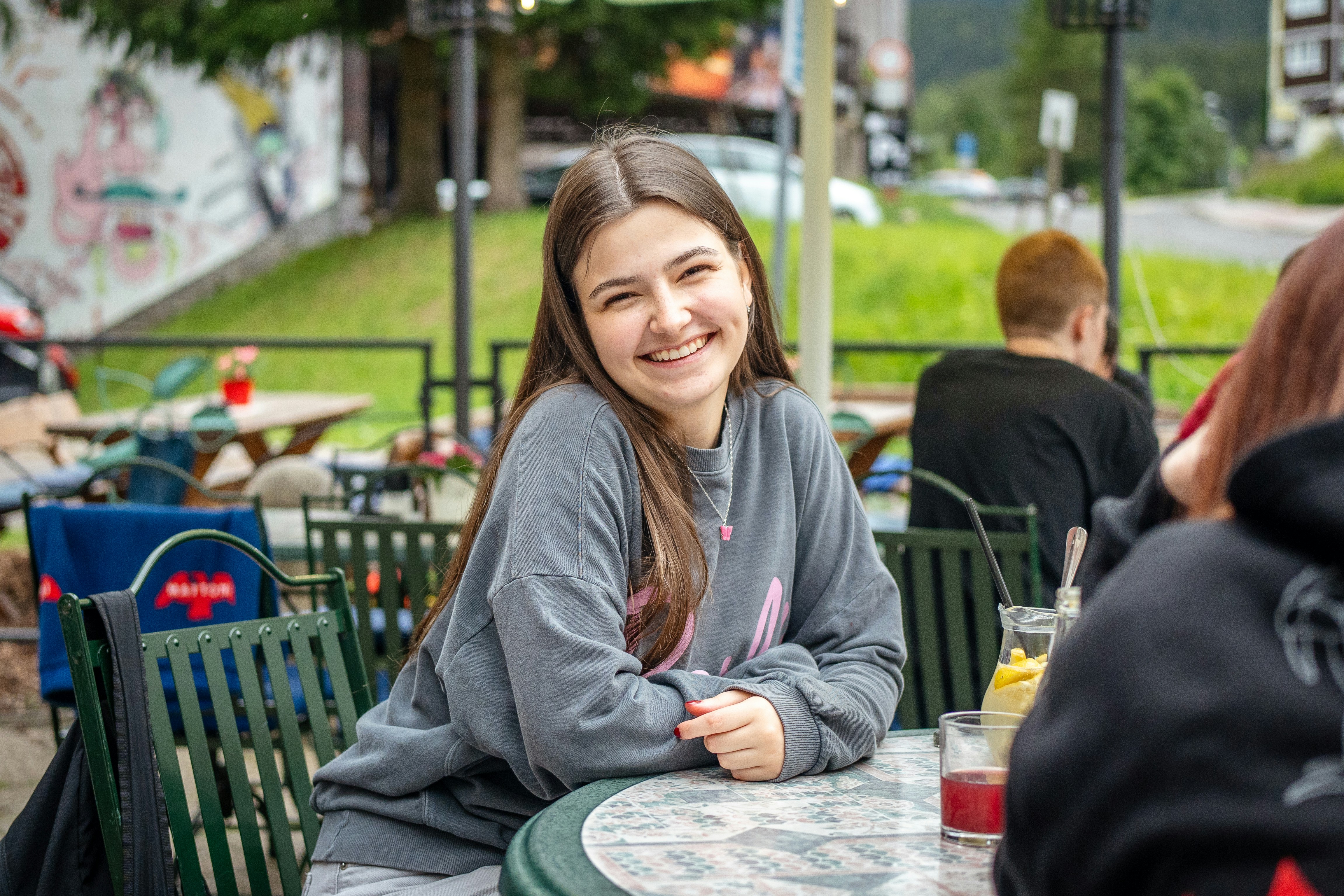 Smiling Moment at the Café Terrace