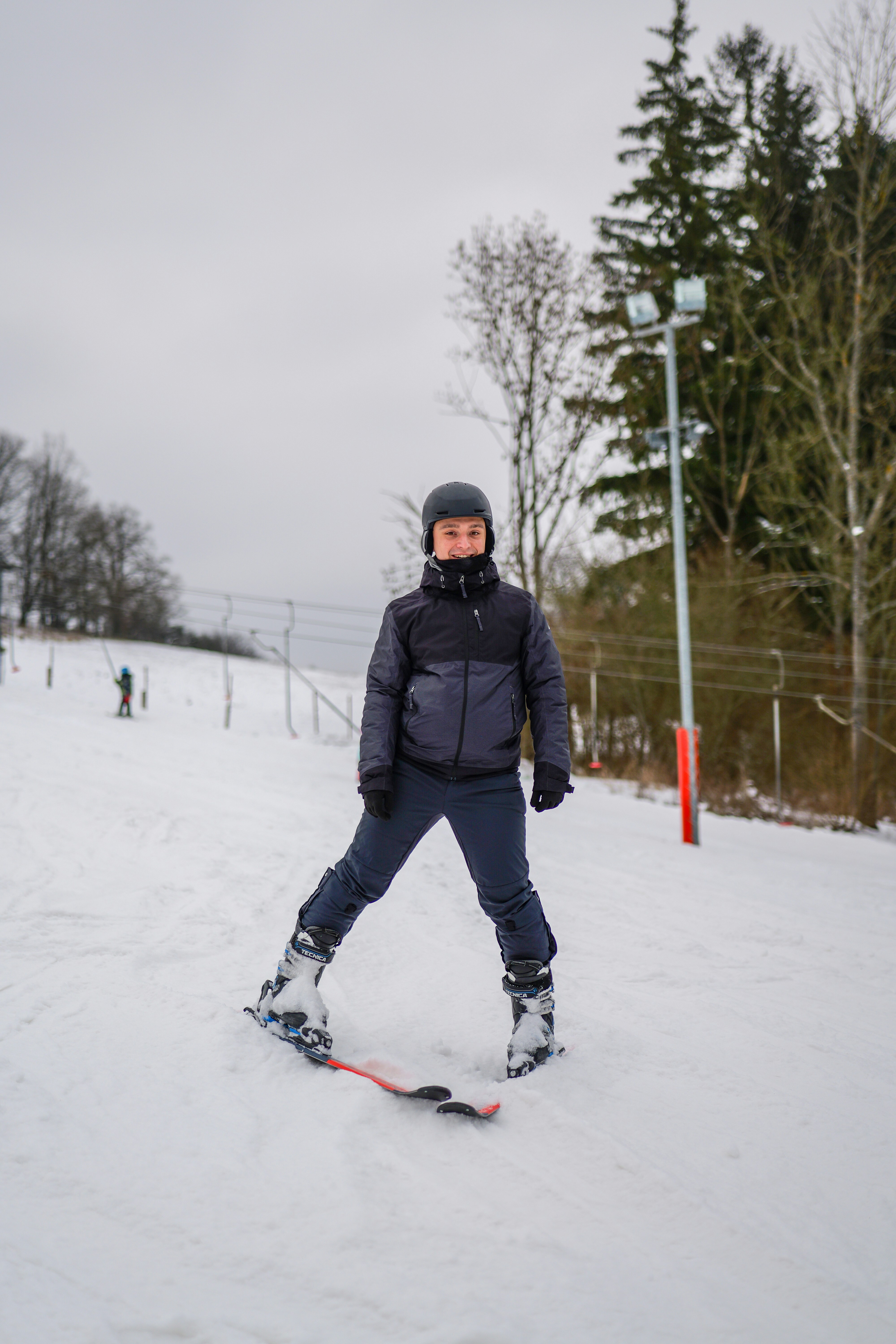 Snowboarder at the Edge: Focused Stance on a Quiet Slope
