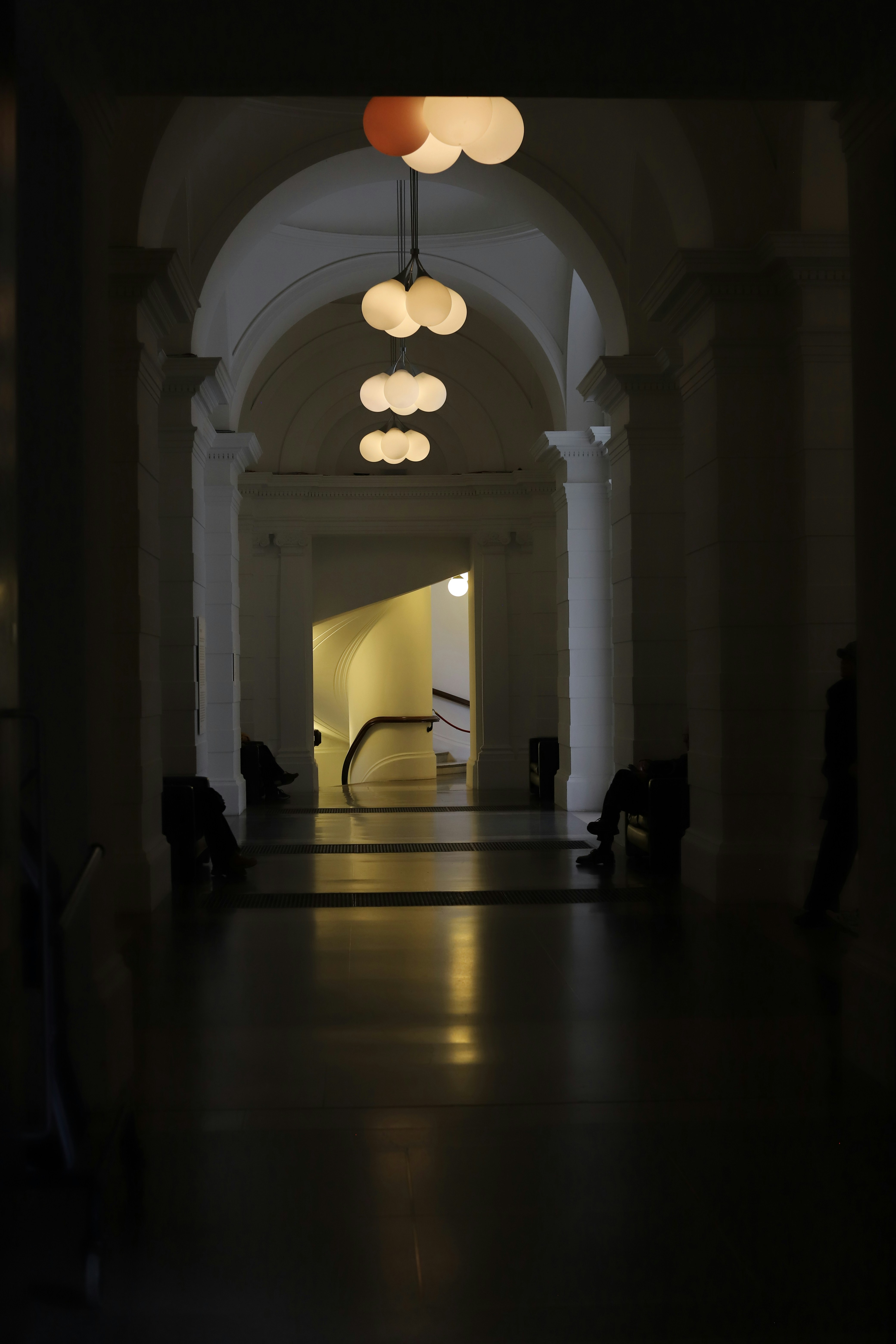 Dimly lit hallway with hanging lights and staircase photo – Free ...