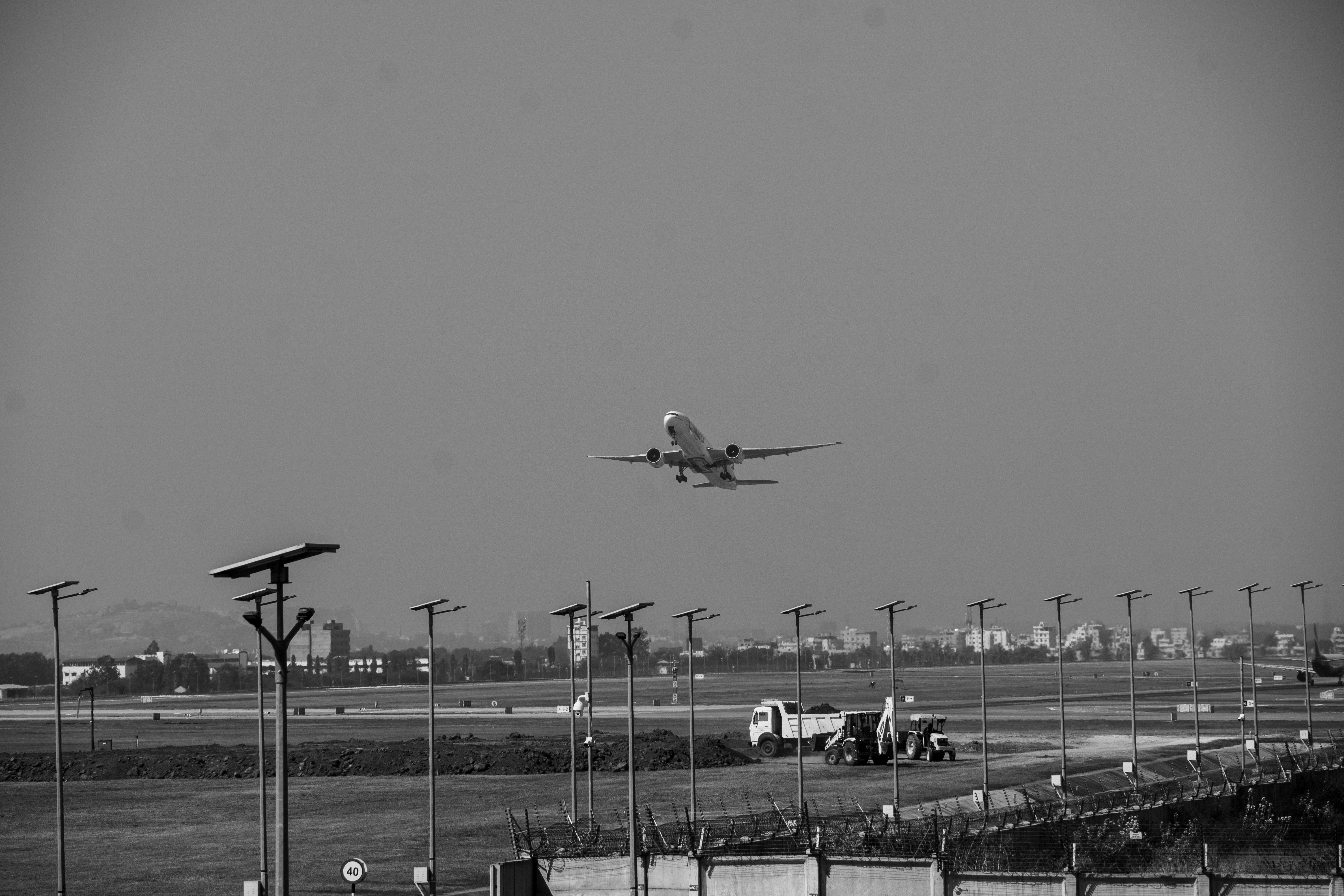 Jet Lift-Off: A Modern Airport Scene in Monochrome