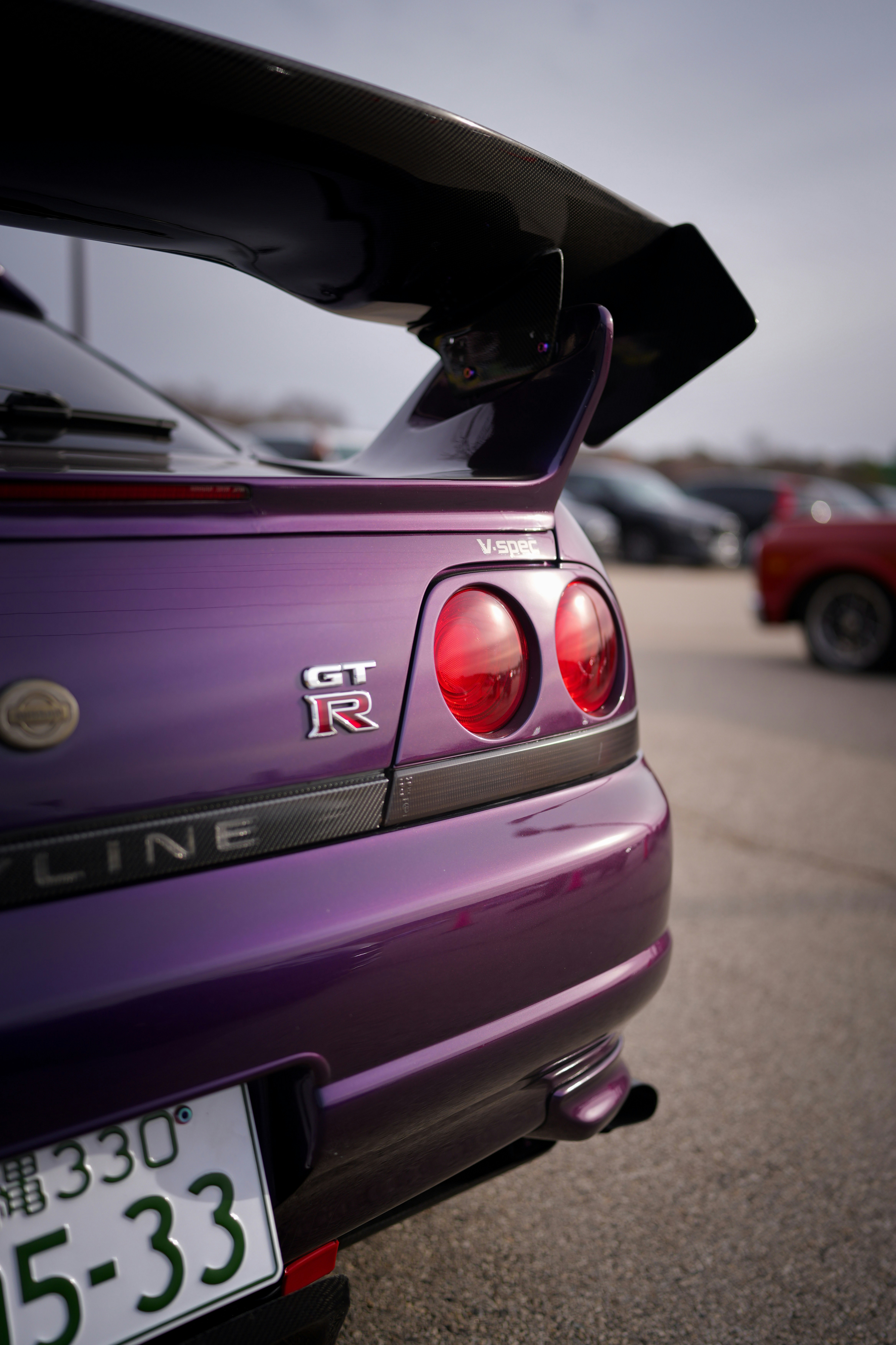 Purple GT-R Tail in Focus: The Curved Spoiler and Round Taillights
