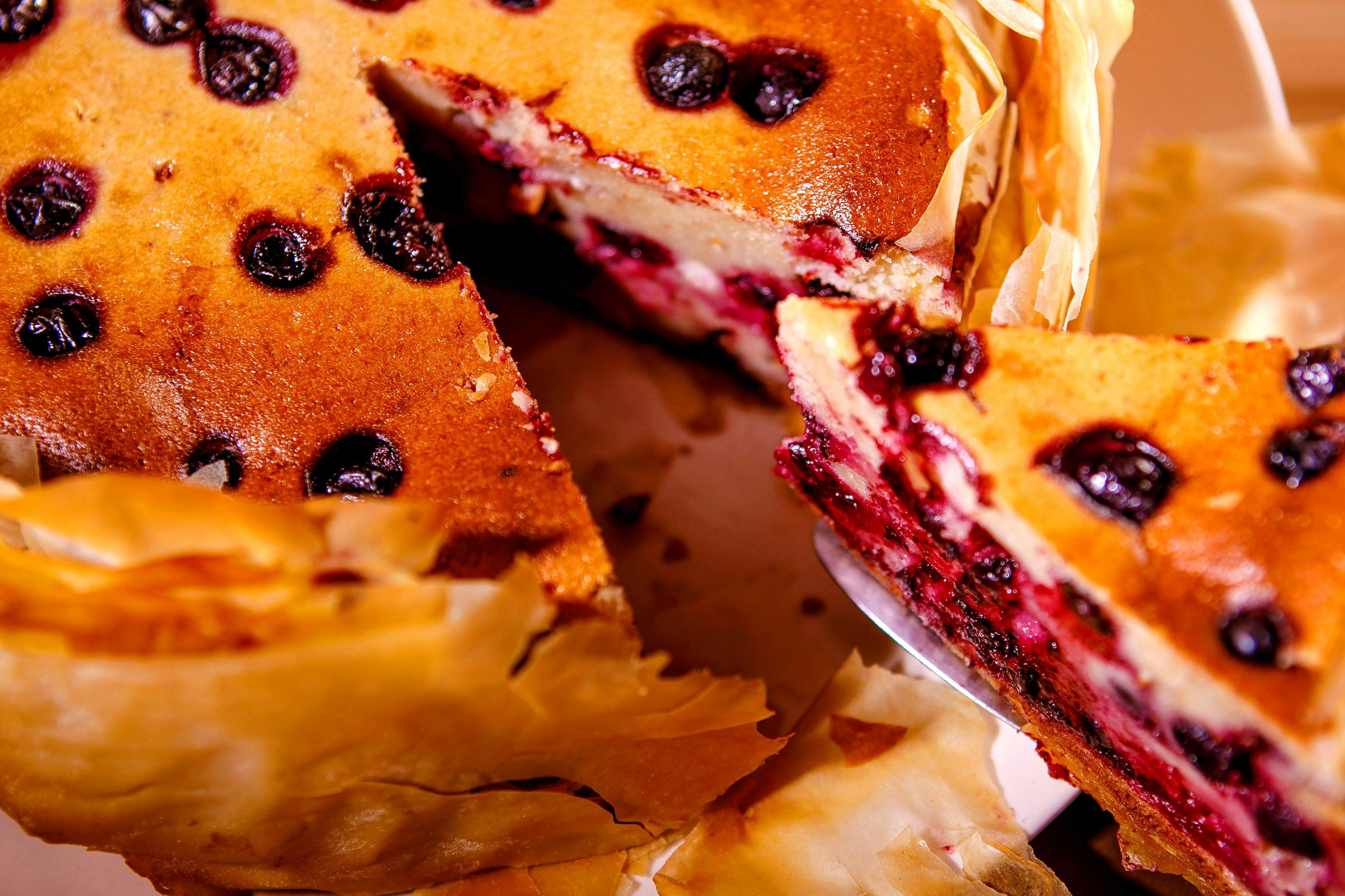 Slice Reveal: A berry-cheese cheesecake breaks through a flaky pastry crust