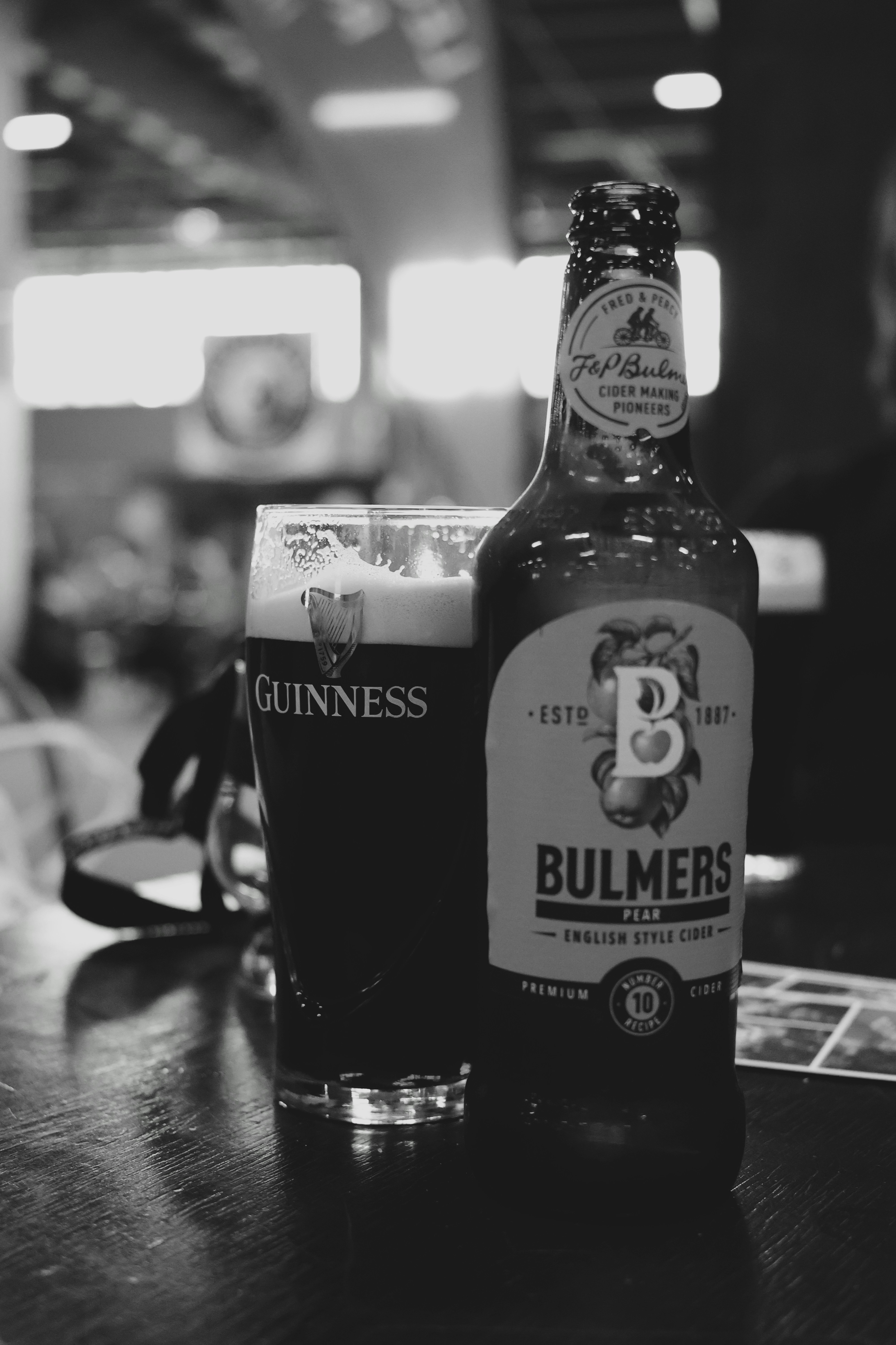 Bulmers and Guinness at the Bar: a close-up of a bottle beside a glass