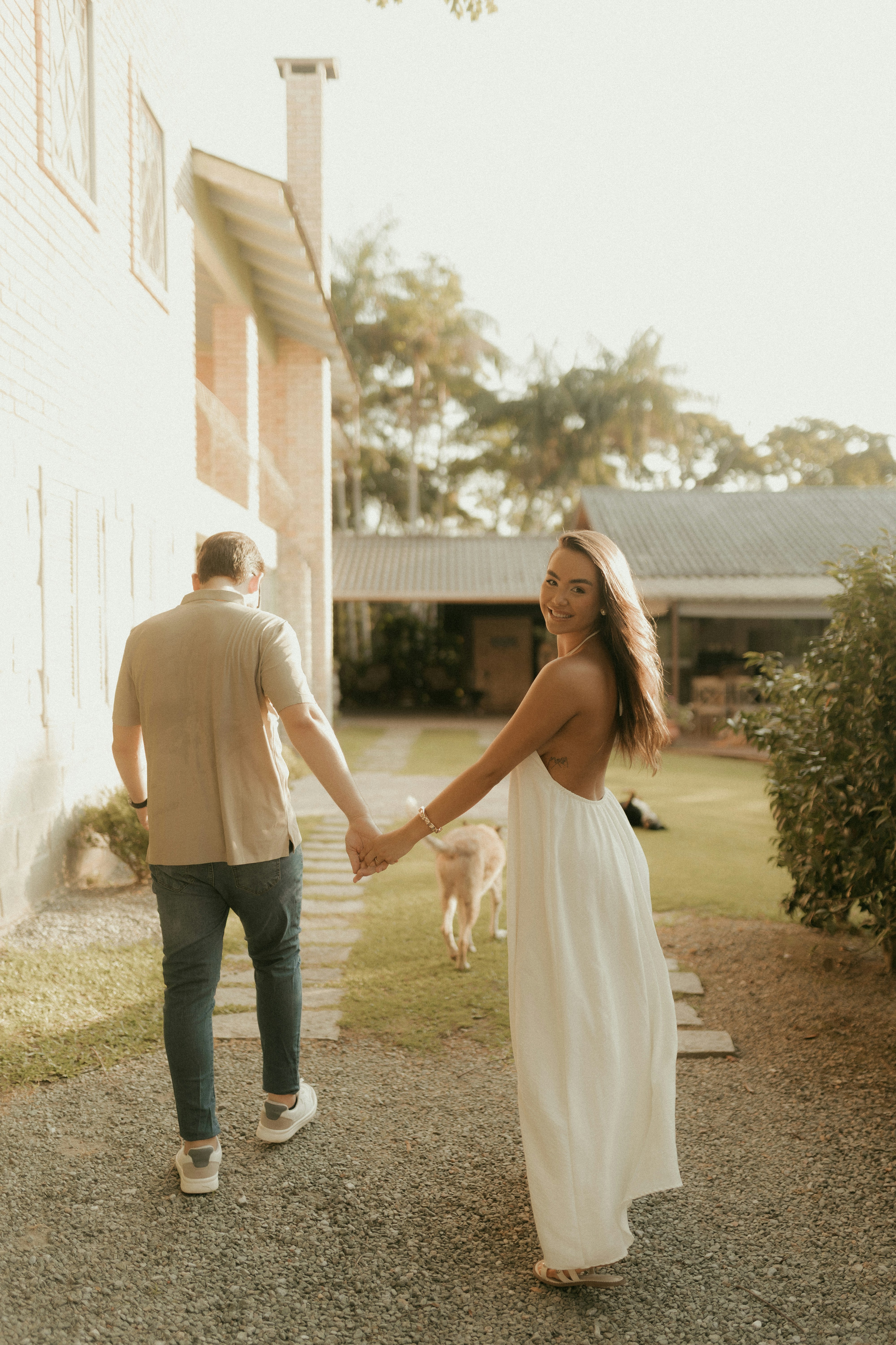 Holding Hands, Sunset Path: A Couple Walks Toward Home