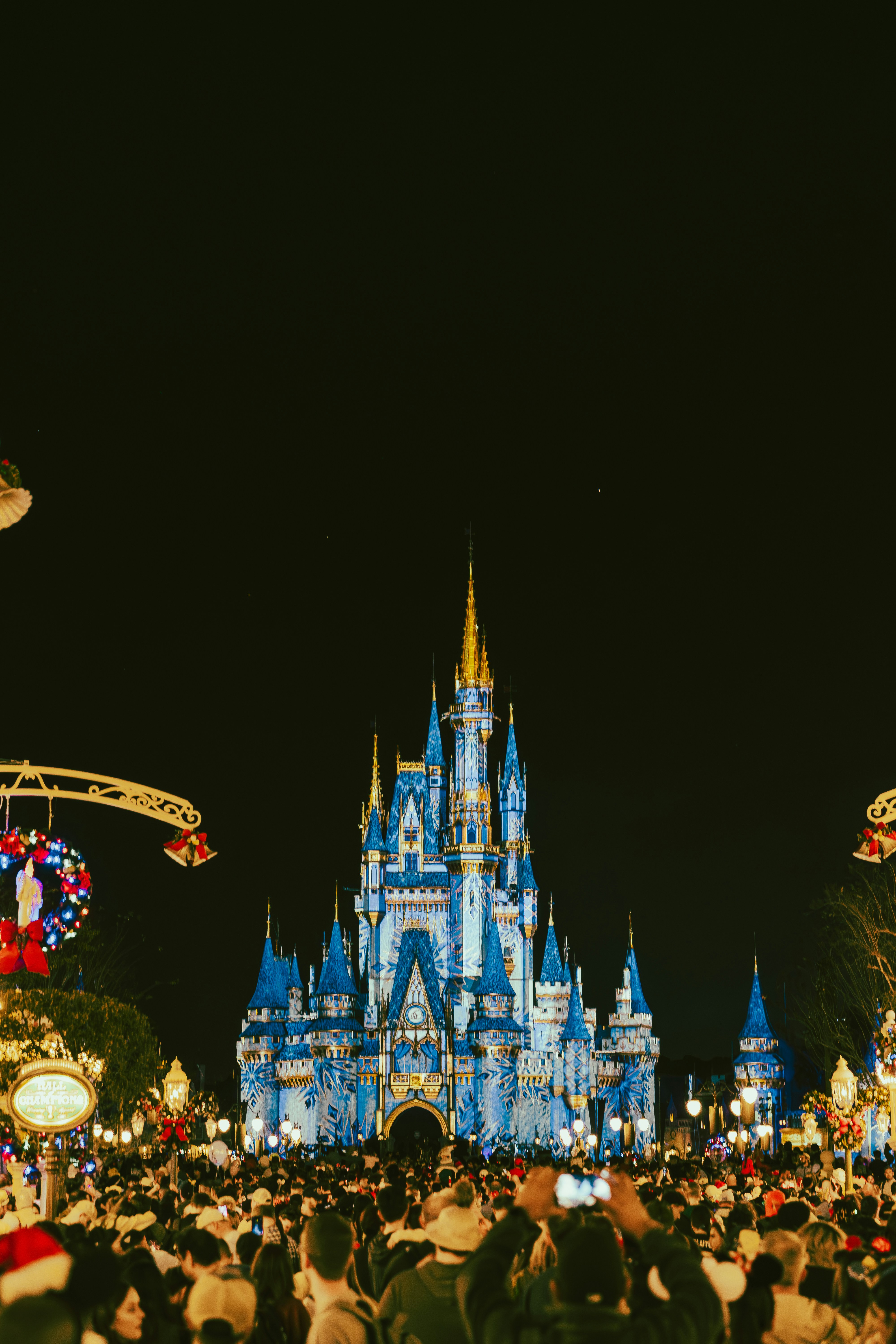 Castle Dreams Under Nightfall: A Sea of Guests at Disney's Sky-Blue Icon