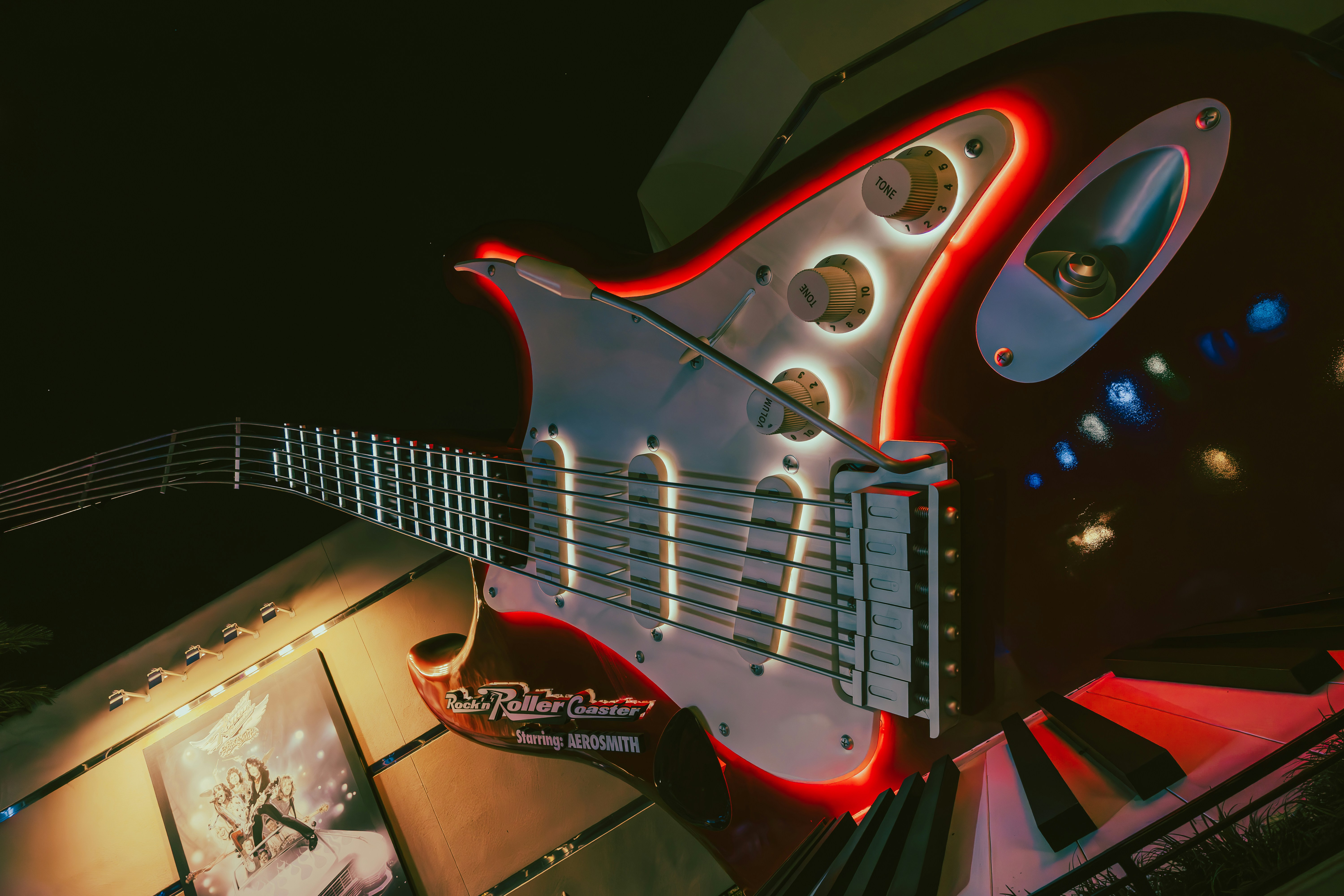 Neon-lit Strat: A Guitar Galaxy on Stage