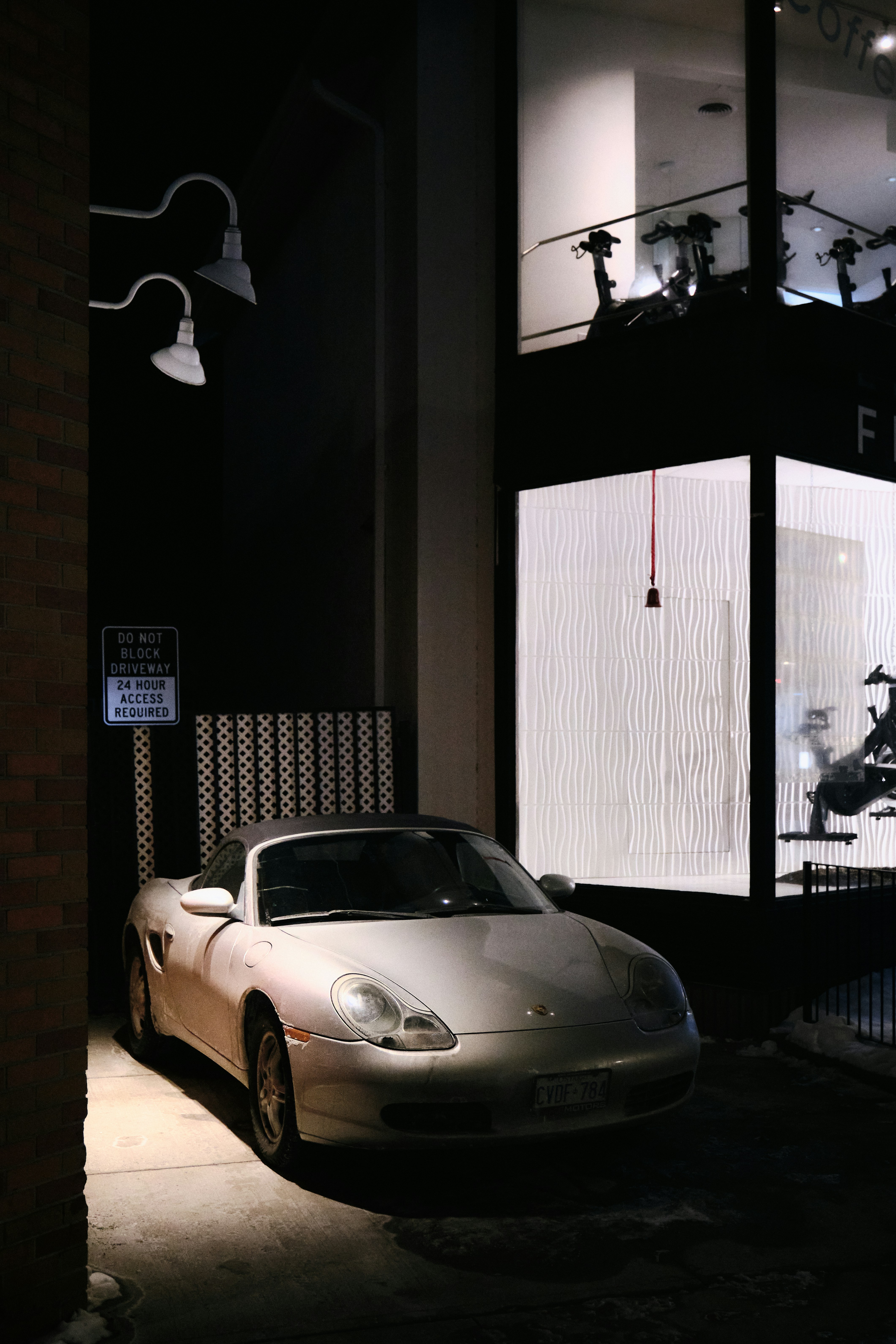 Night Drive Aligned: A Silver Porsche in a Quiet Urban Glow