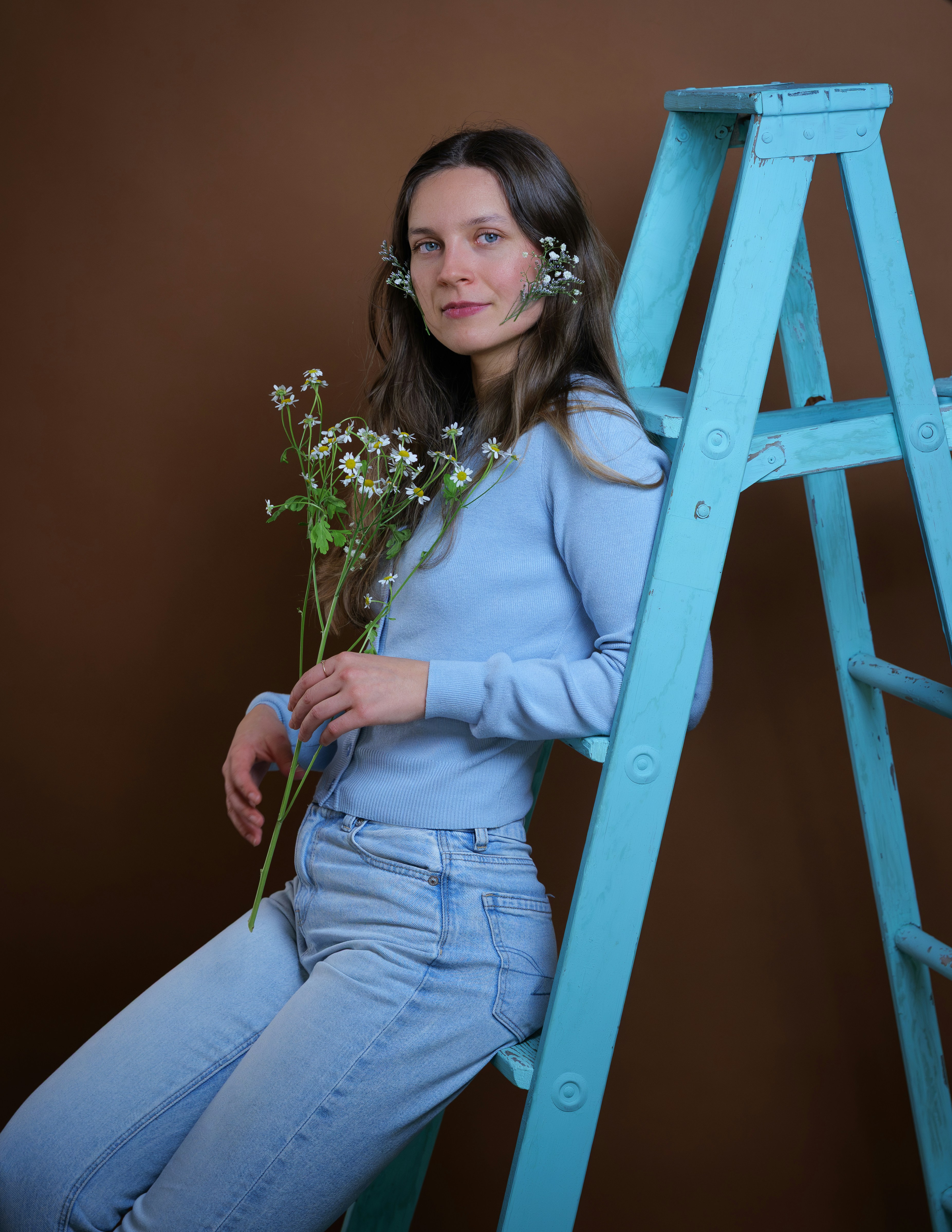 Bloomed Stillness: A Quiet Portrait by the Turquoise Ladder