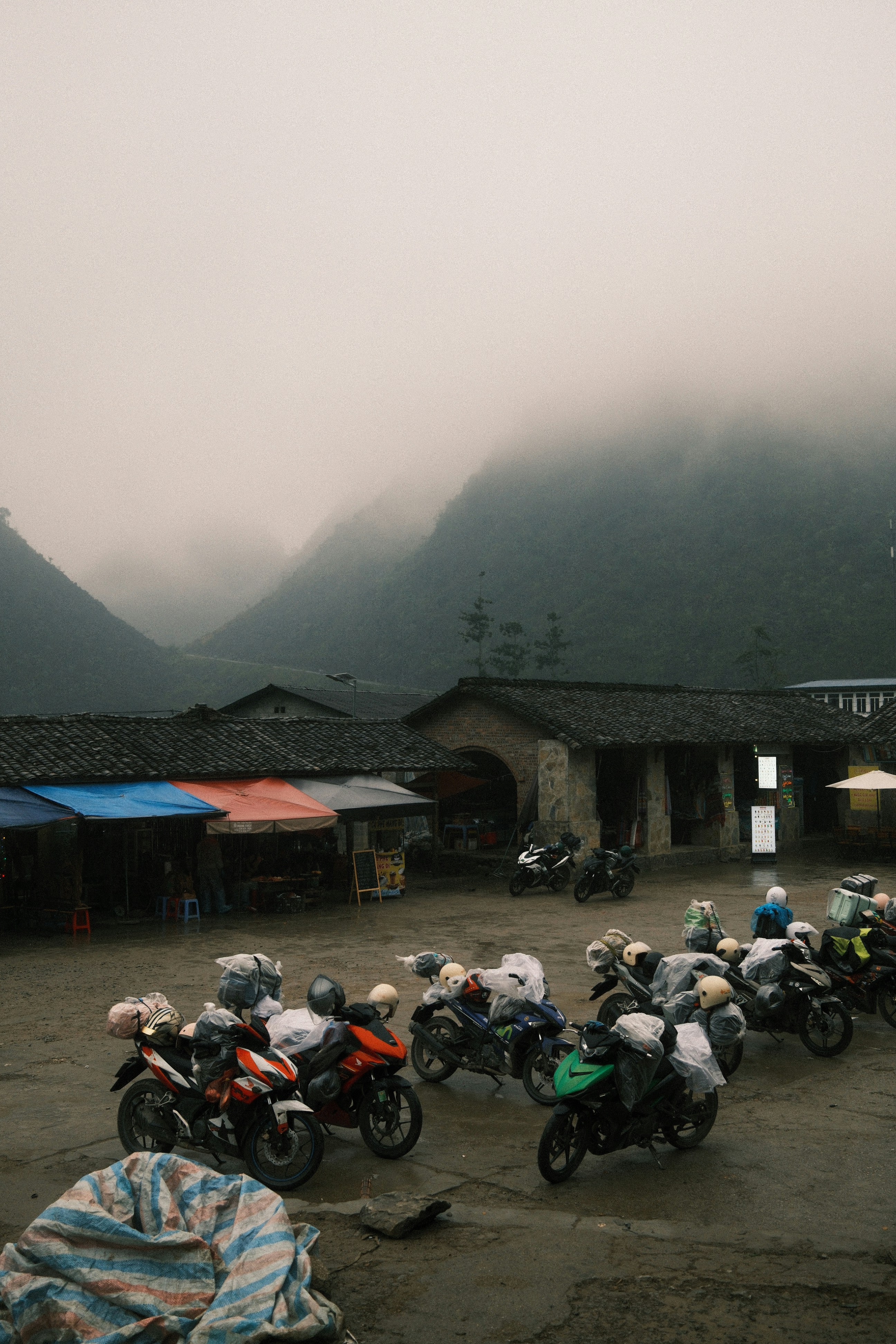 Motorcycle Bazaar Beneath Misty Mountain Village