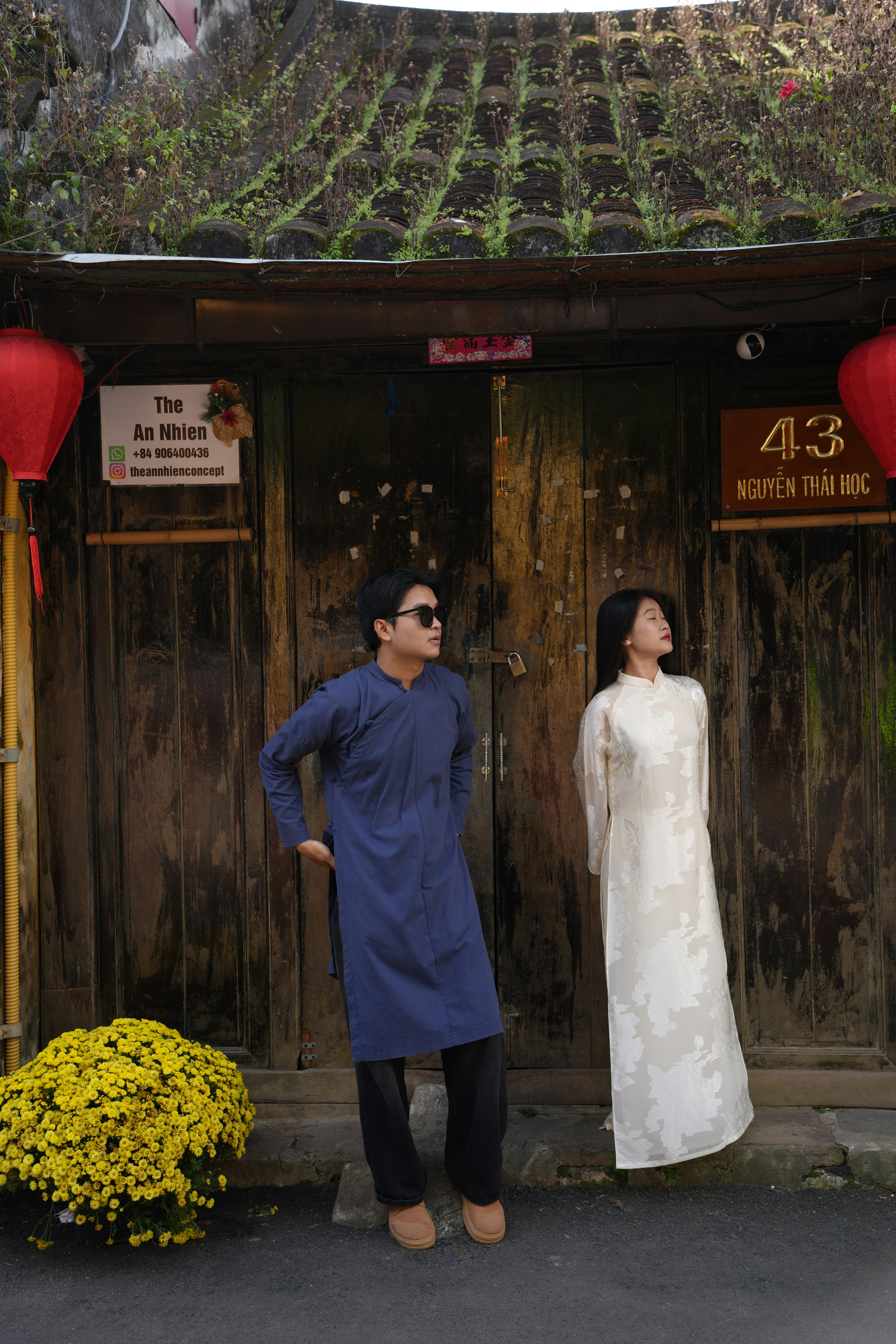 Traditional Attire in Front of Weathered Doors