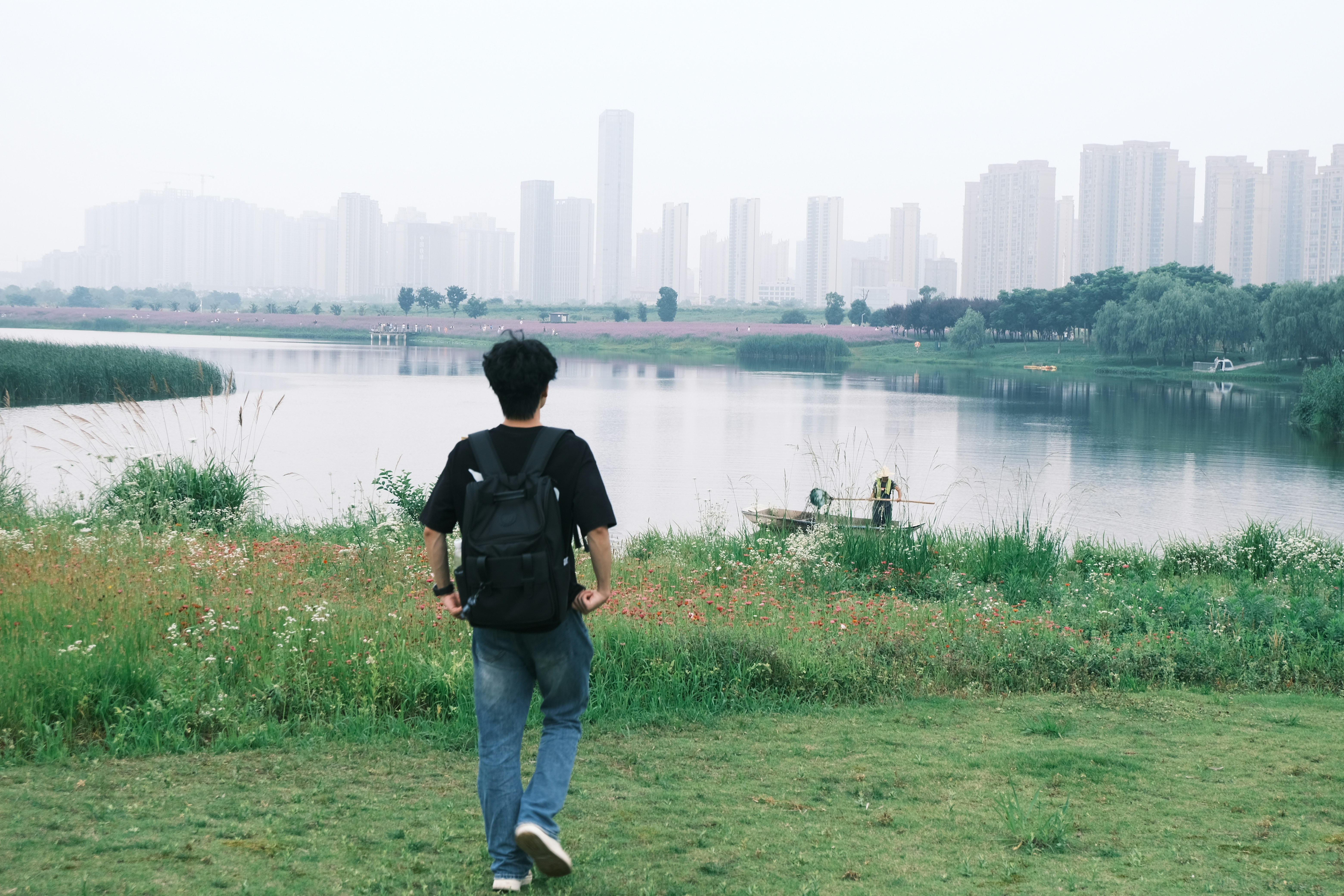 Traveler at the Riverside Gate: City Horizon Looming Beyond