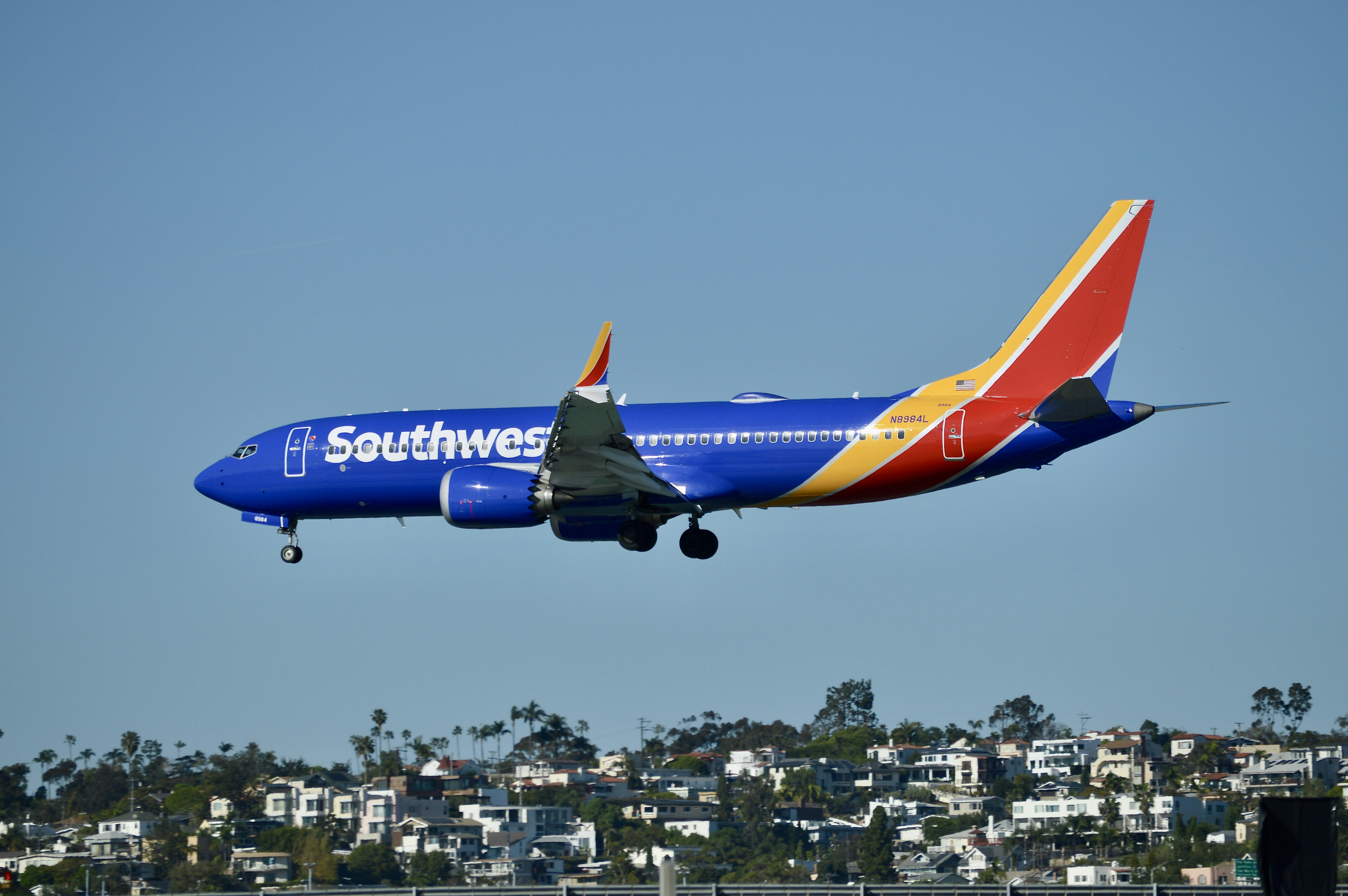 Southwest Skyline: A Blue Arrow Over the Suburban Horizon