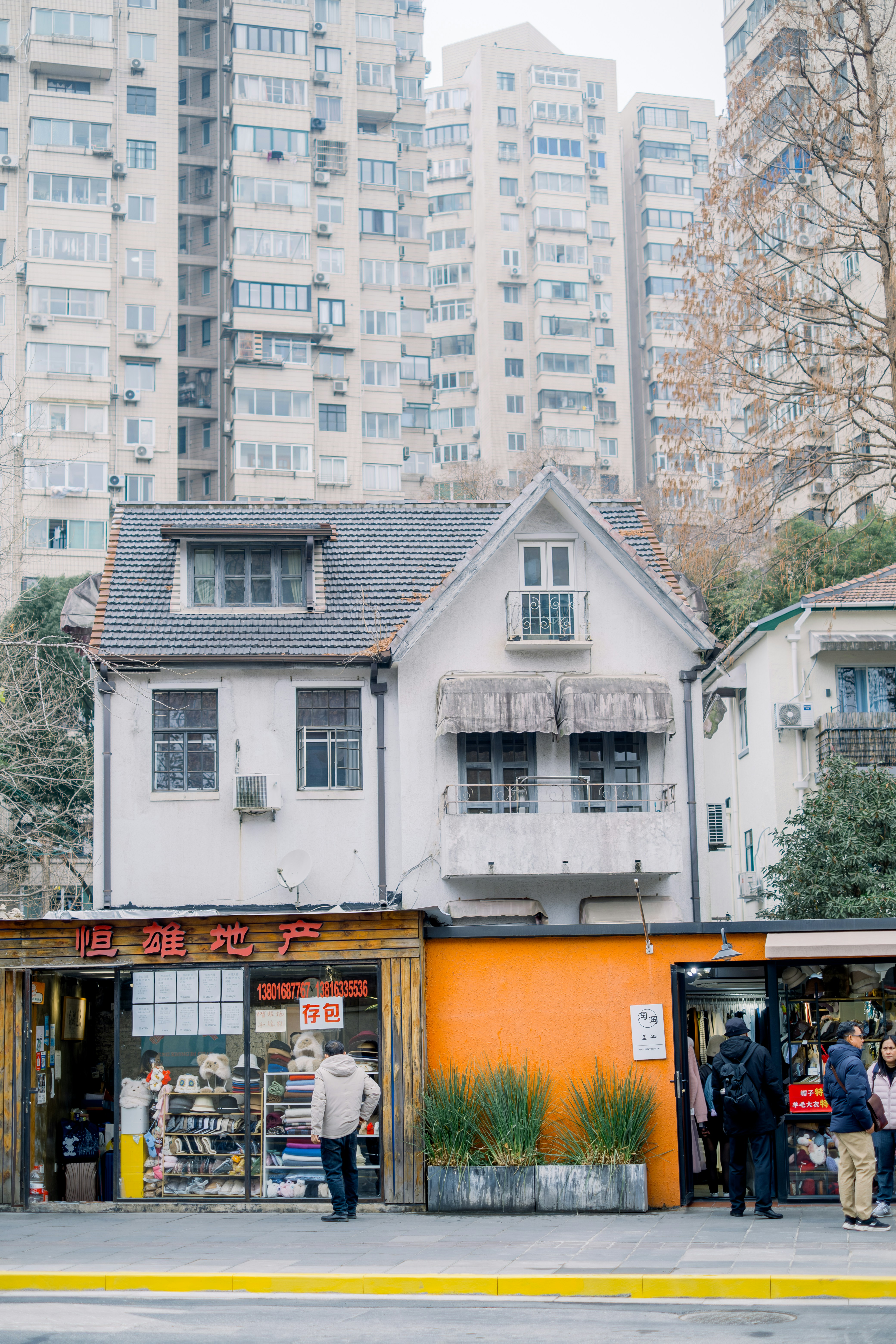 Urban Ground Floor: A Quiet Shopfront Framed by Distant Apartments