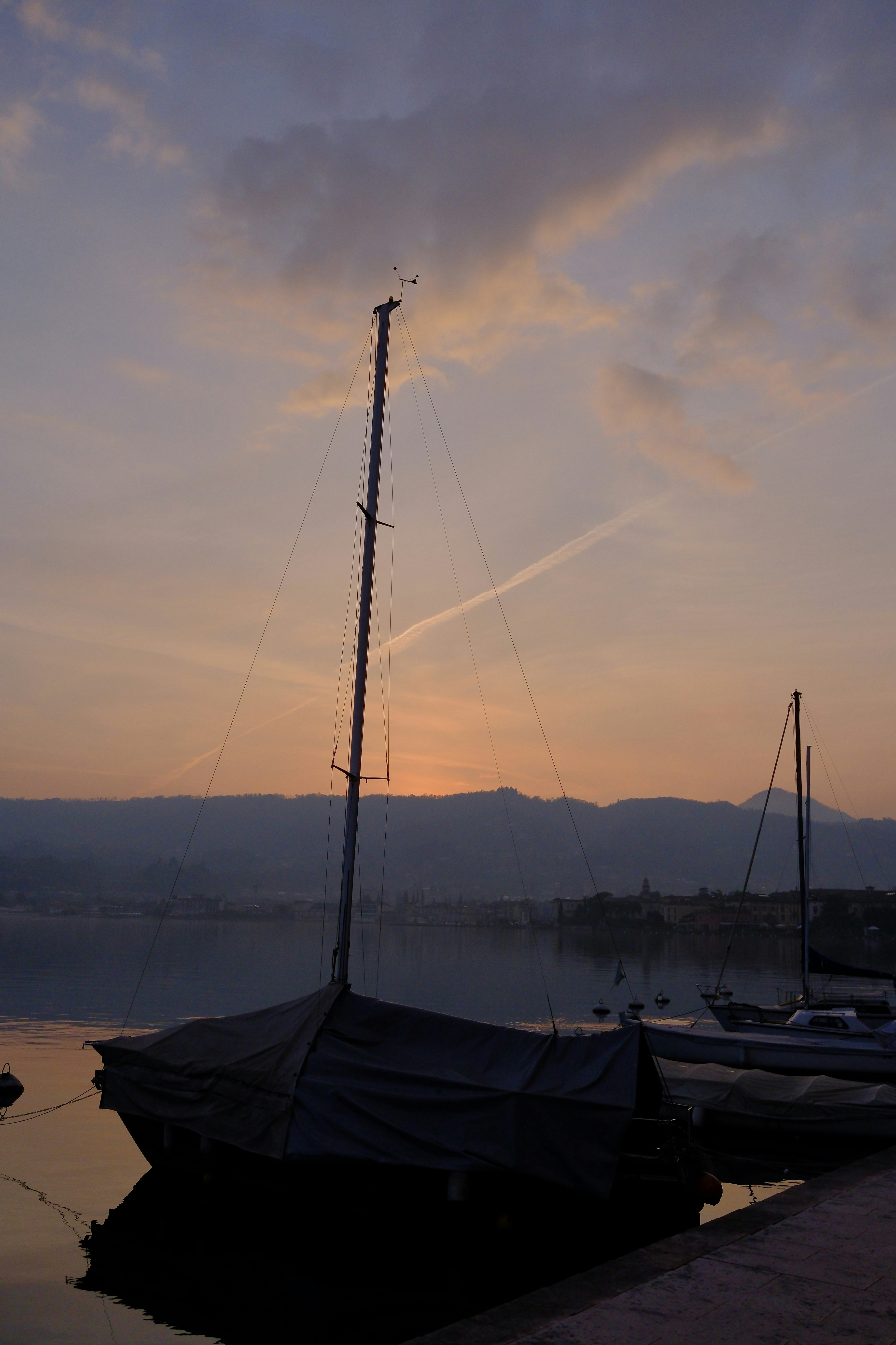 Sunset Slip: A Sailboat Quietly Anchored at Dusk