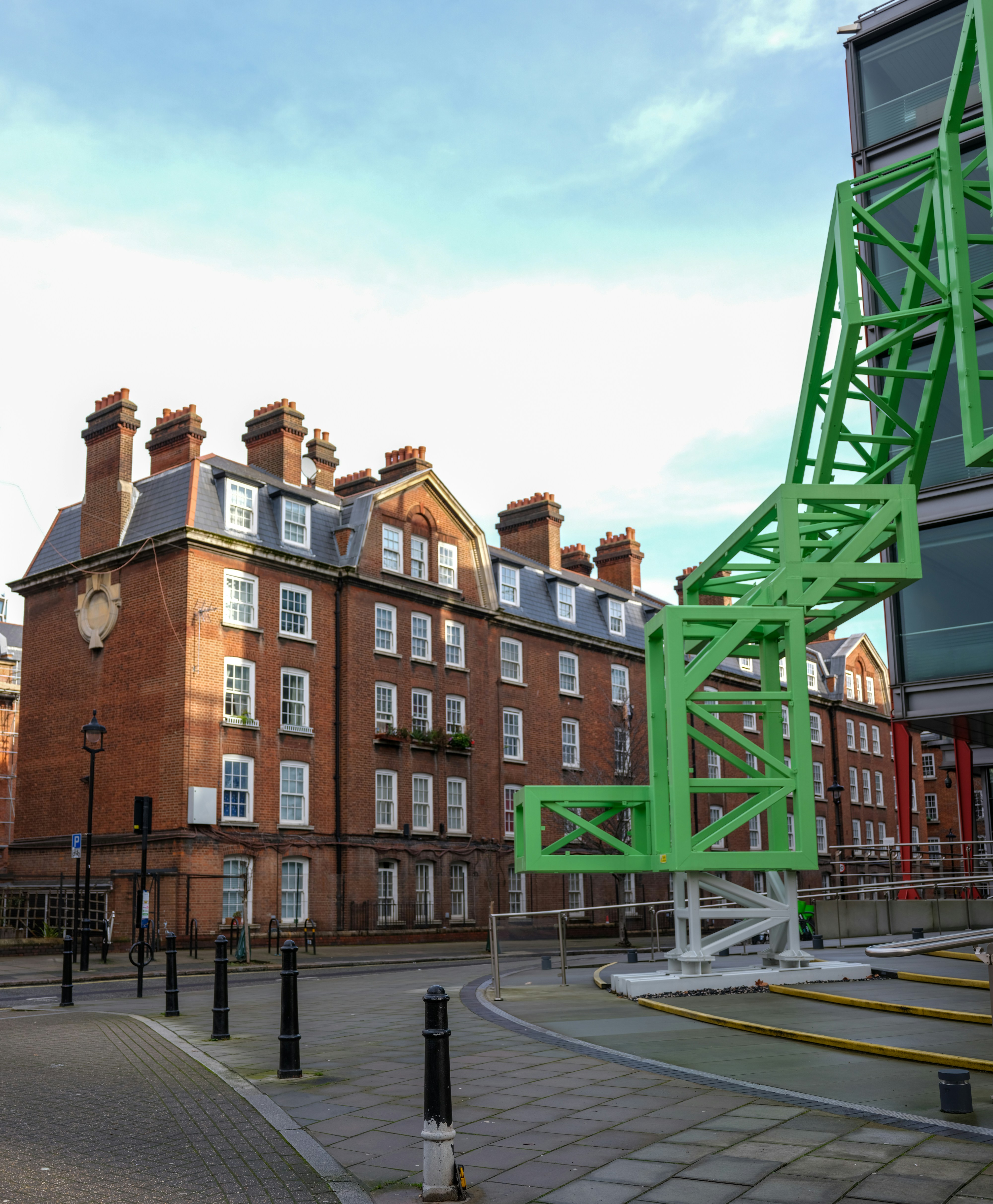 Green Frame Meets Brick Skyline