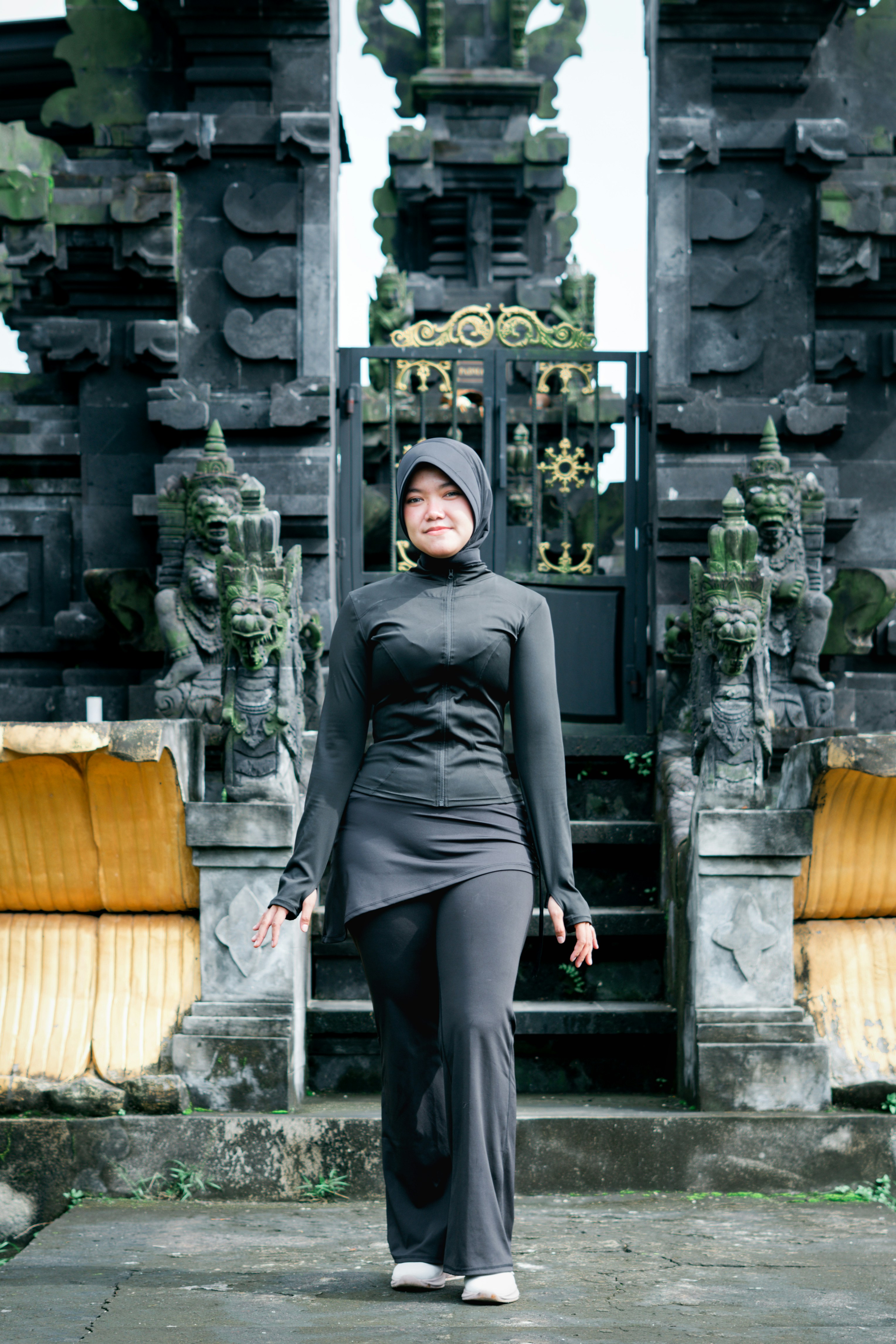 Veiled in Black: A Quiet Stride Through Ancient Gates
