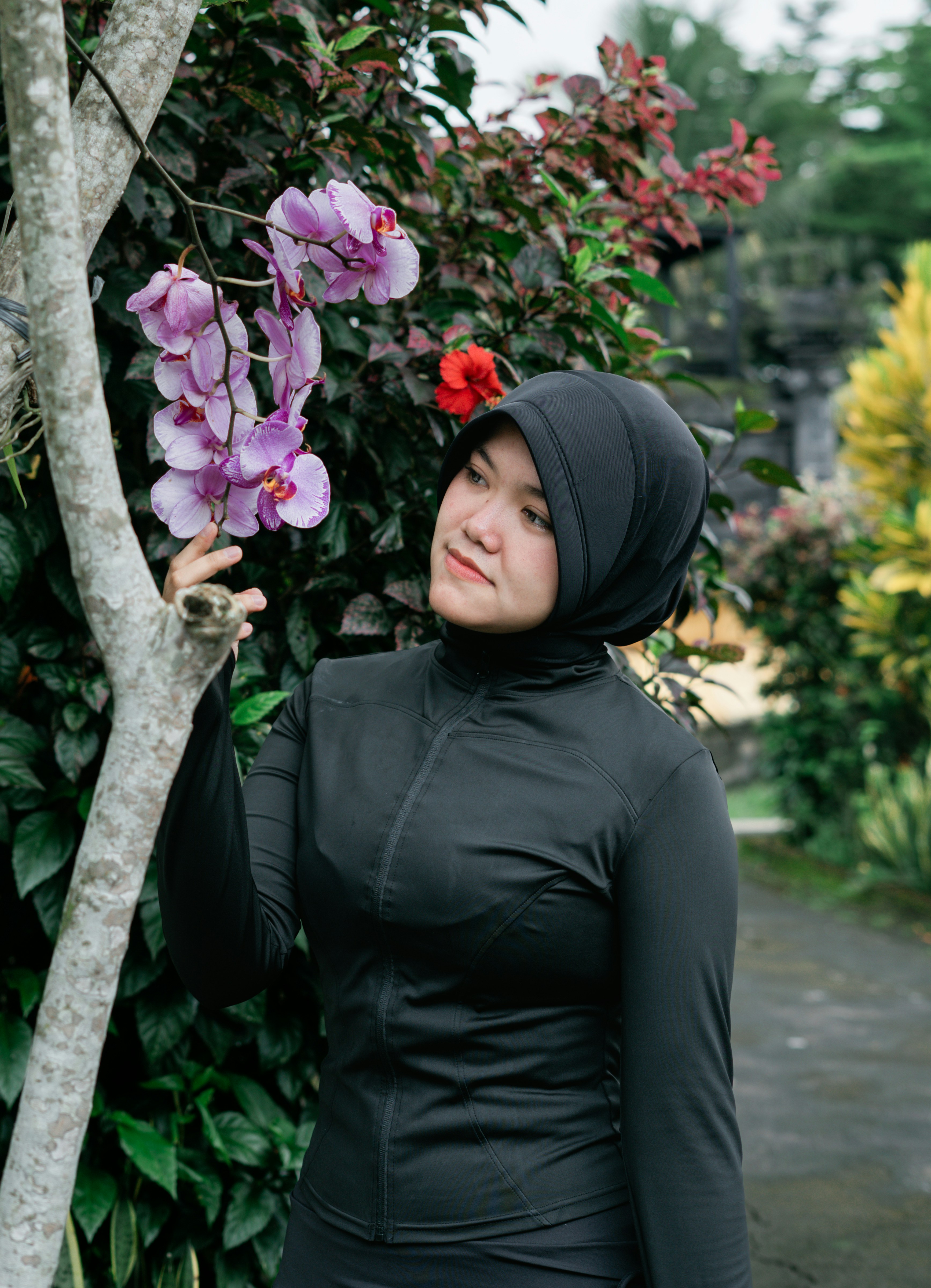 Portrait in Bloom: A Quiet Moment with Orchid Branches