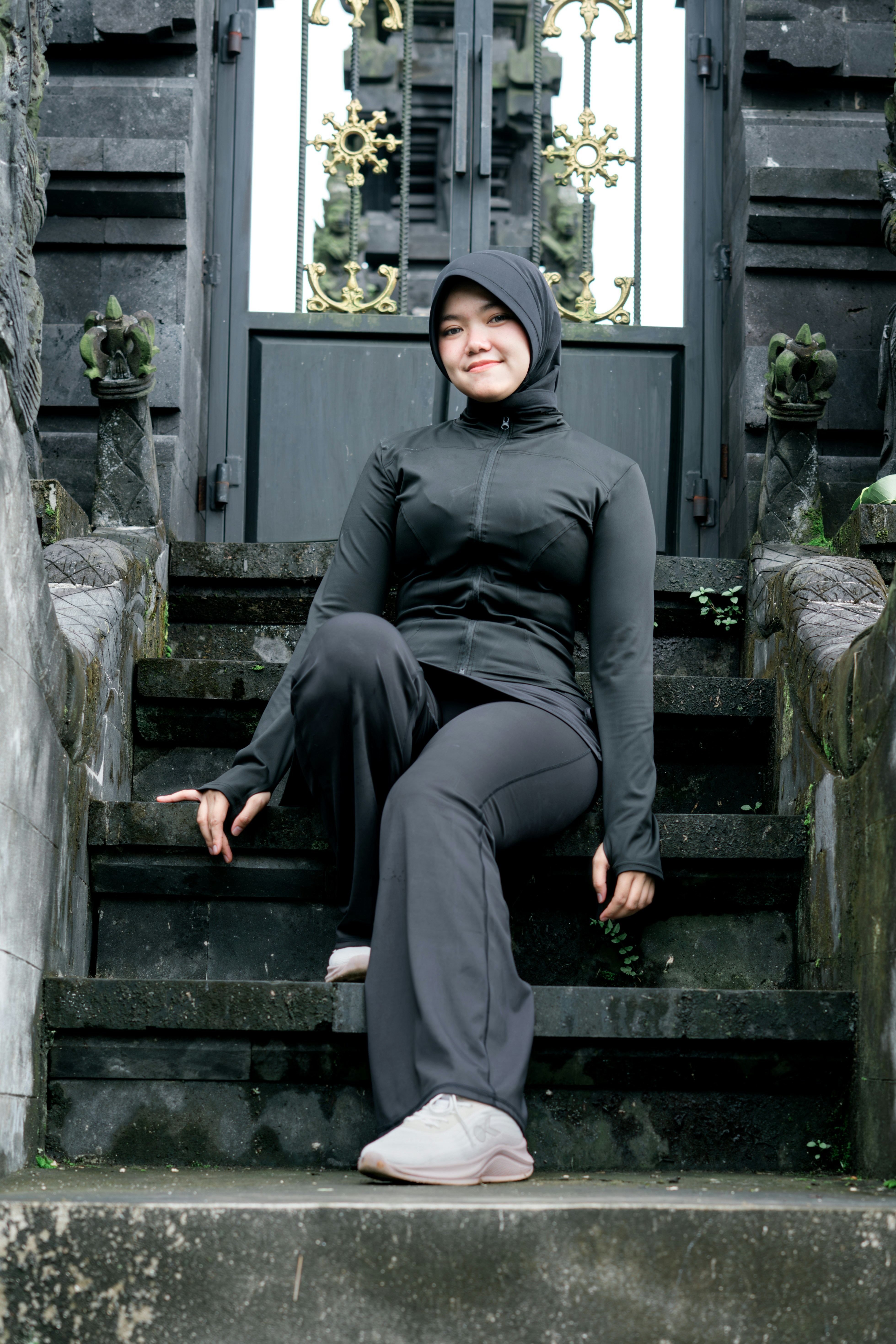 Crossing the Steps: A Quiet Moment in a Dark Gym Attire