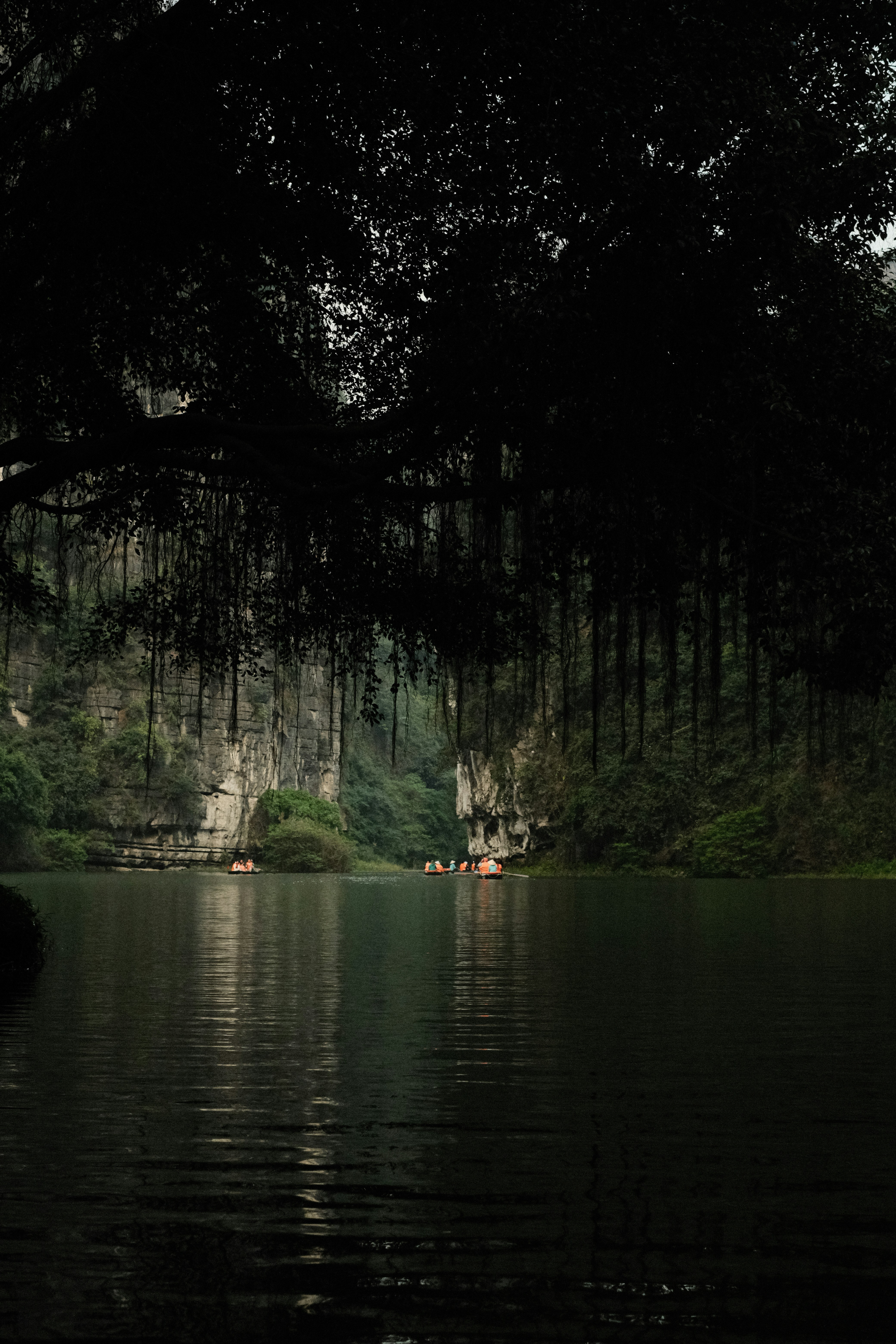 Shadows Over the Water: A Canoe Kiss Between Caves