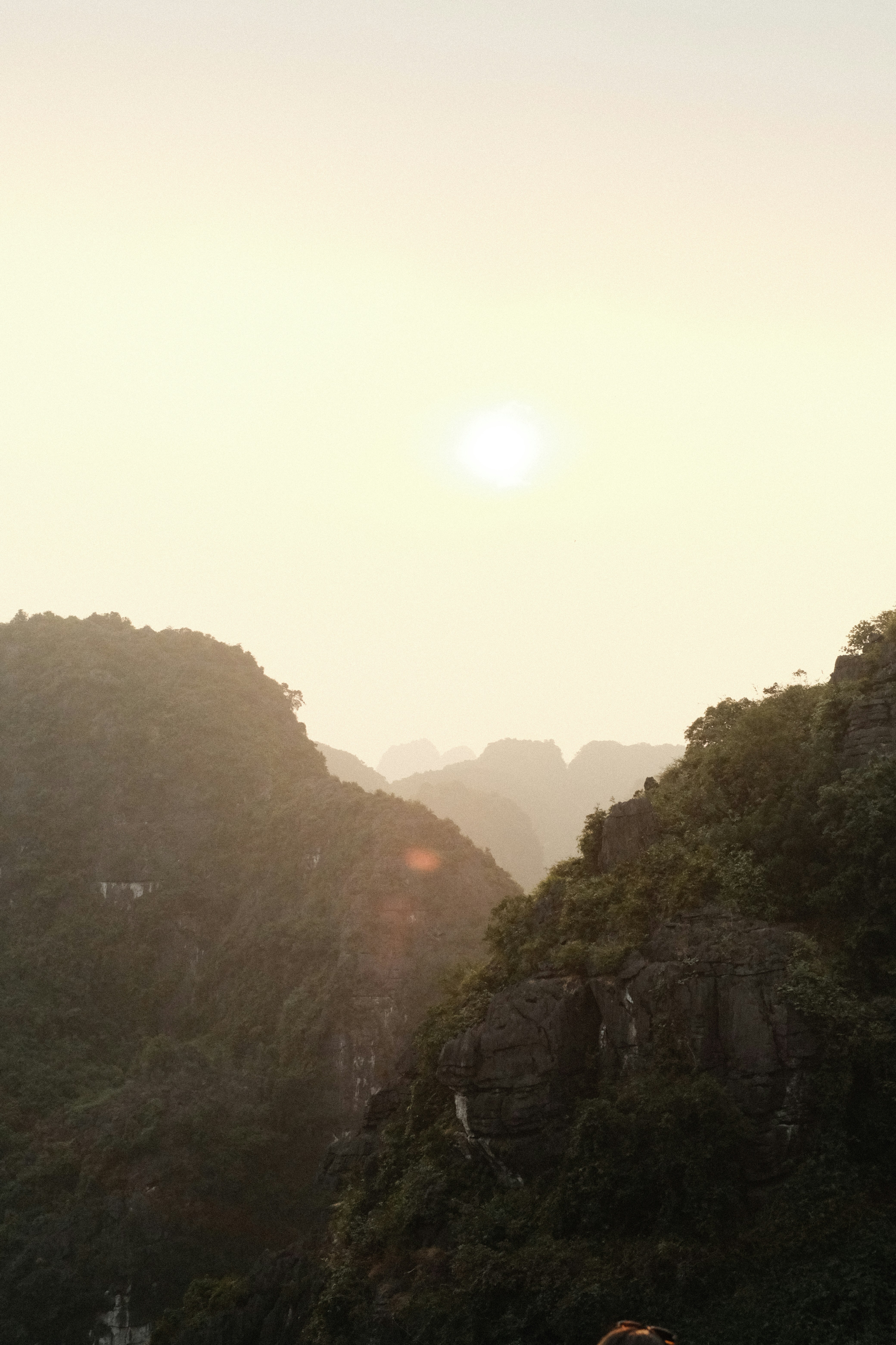 Sunlit Valleys at Dusk Over Carved Peaks