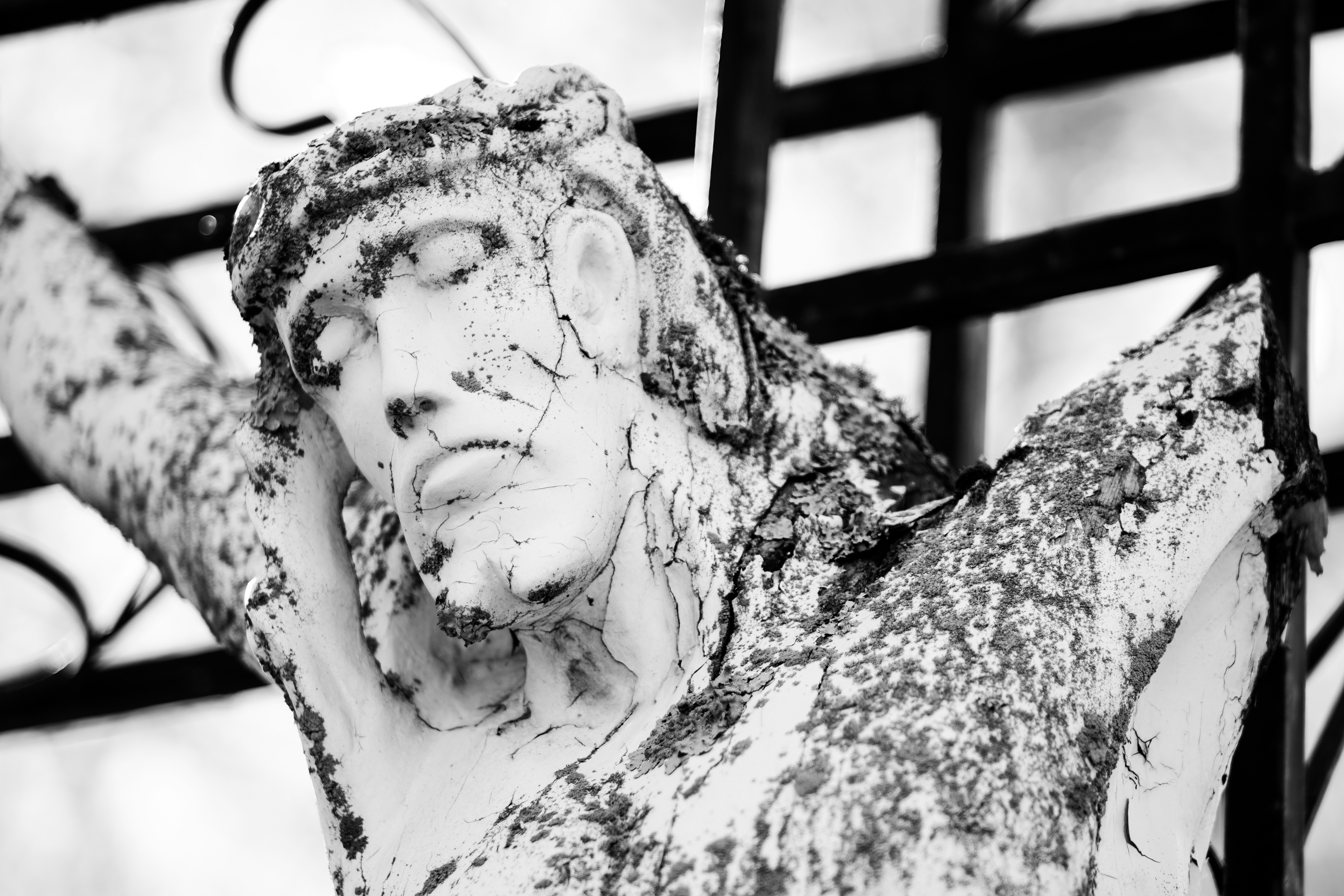 Weathered Guardian: A weathered sculpture in black and white