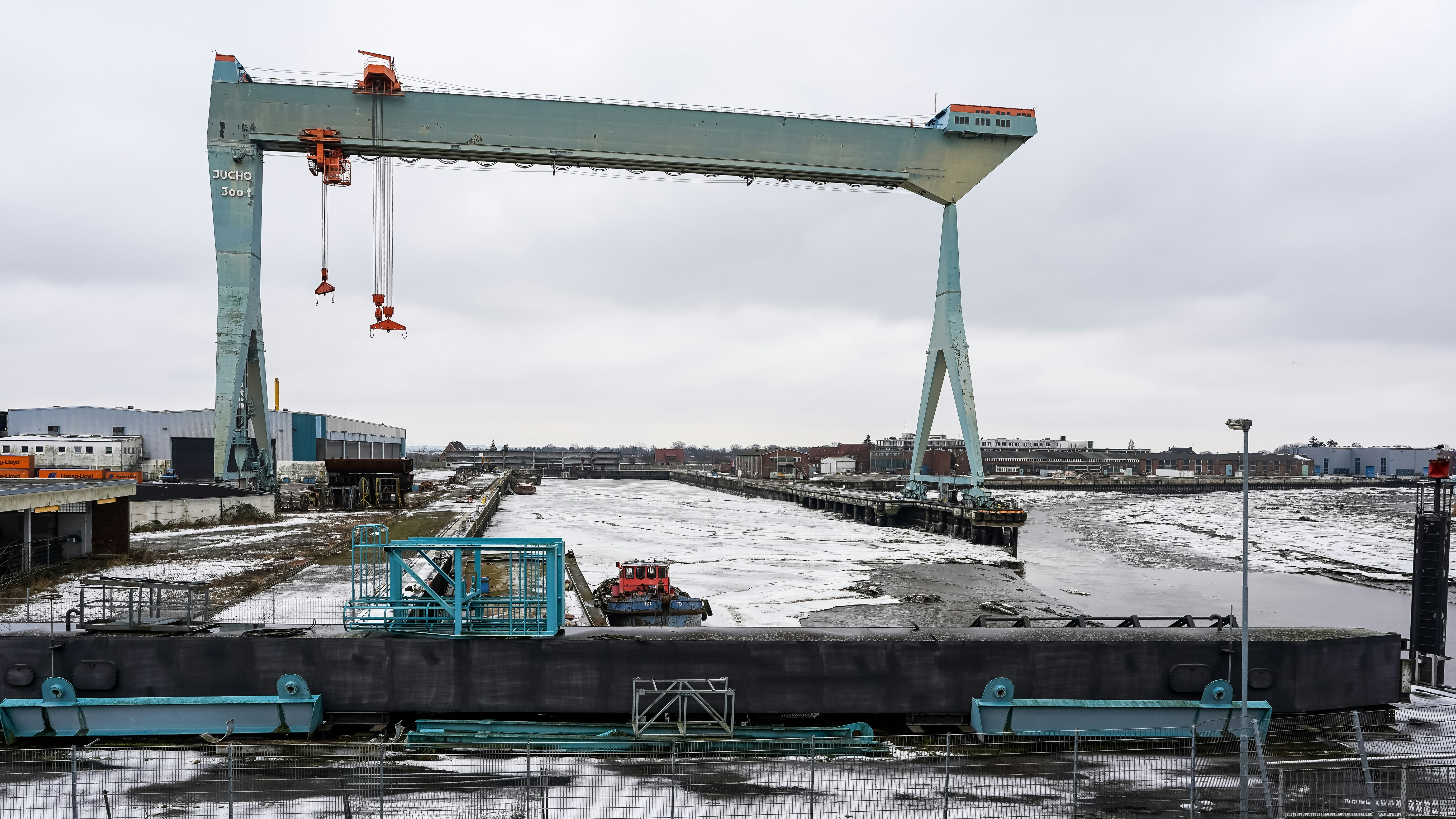 Gantry Crane Over a Quiet Harbor: Winter at the Lock