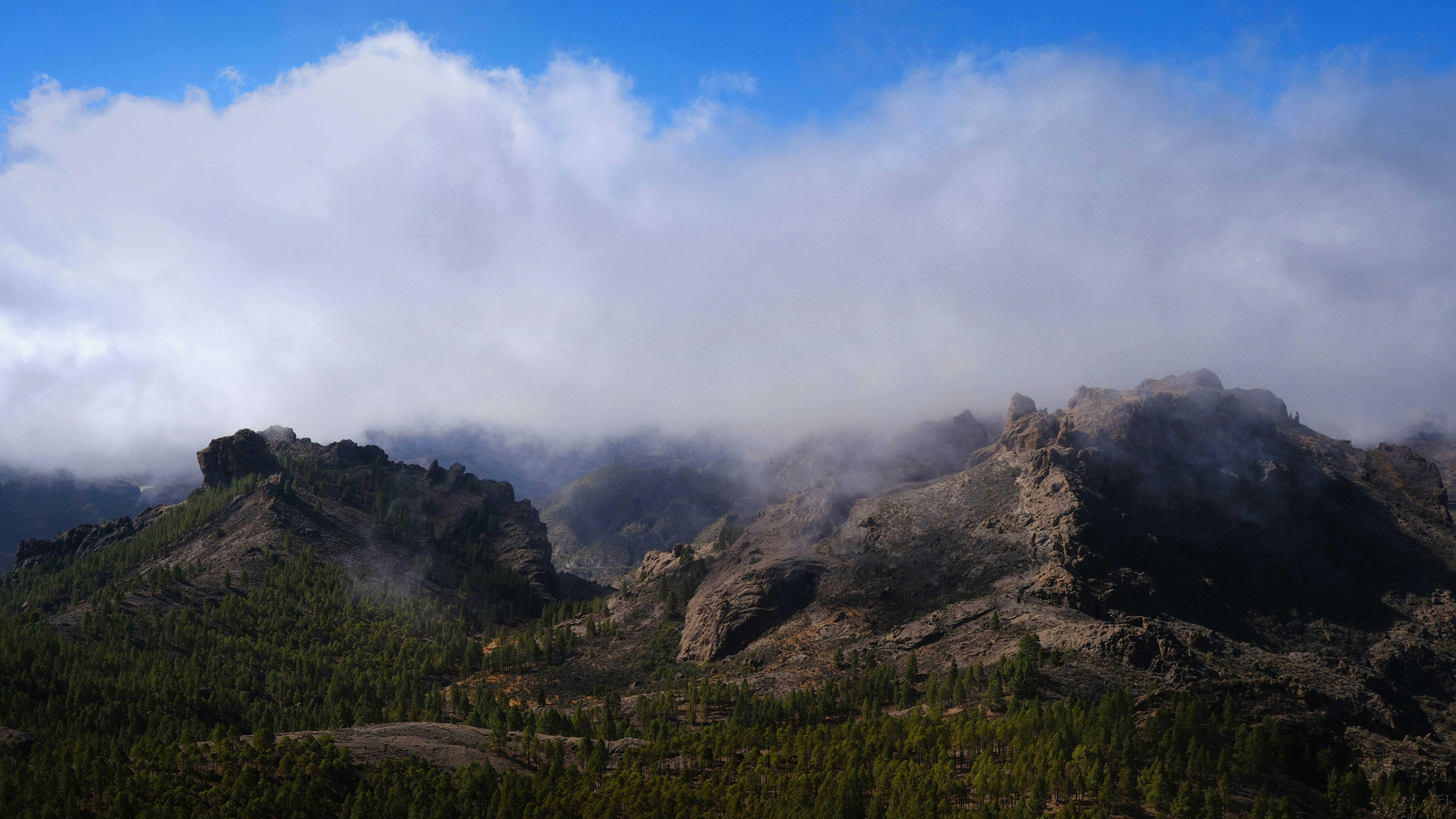 Misty Ridge under a Break in the Clouds