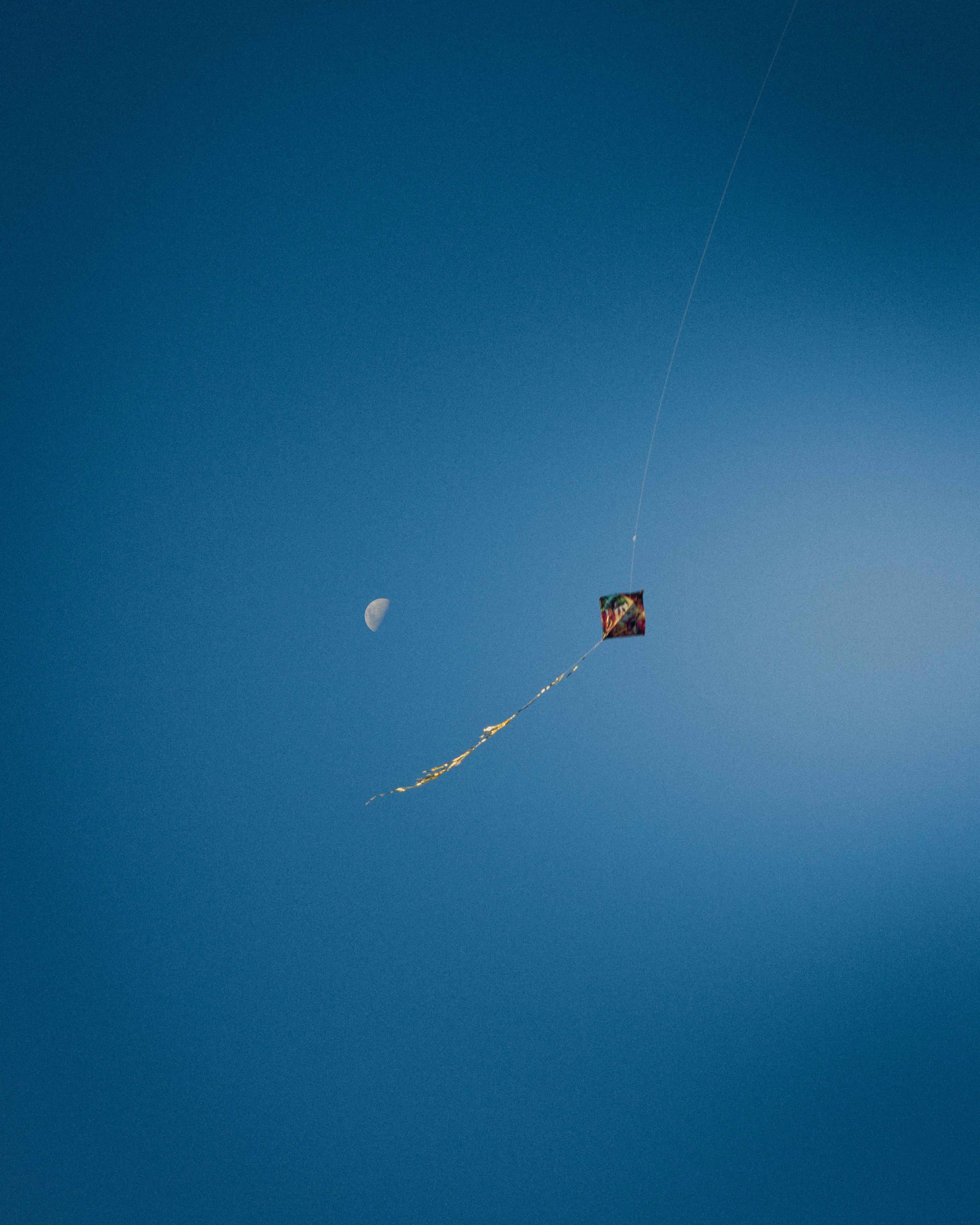 High-Tether: Tiny Kite against a Wide Blue Sky