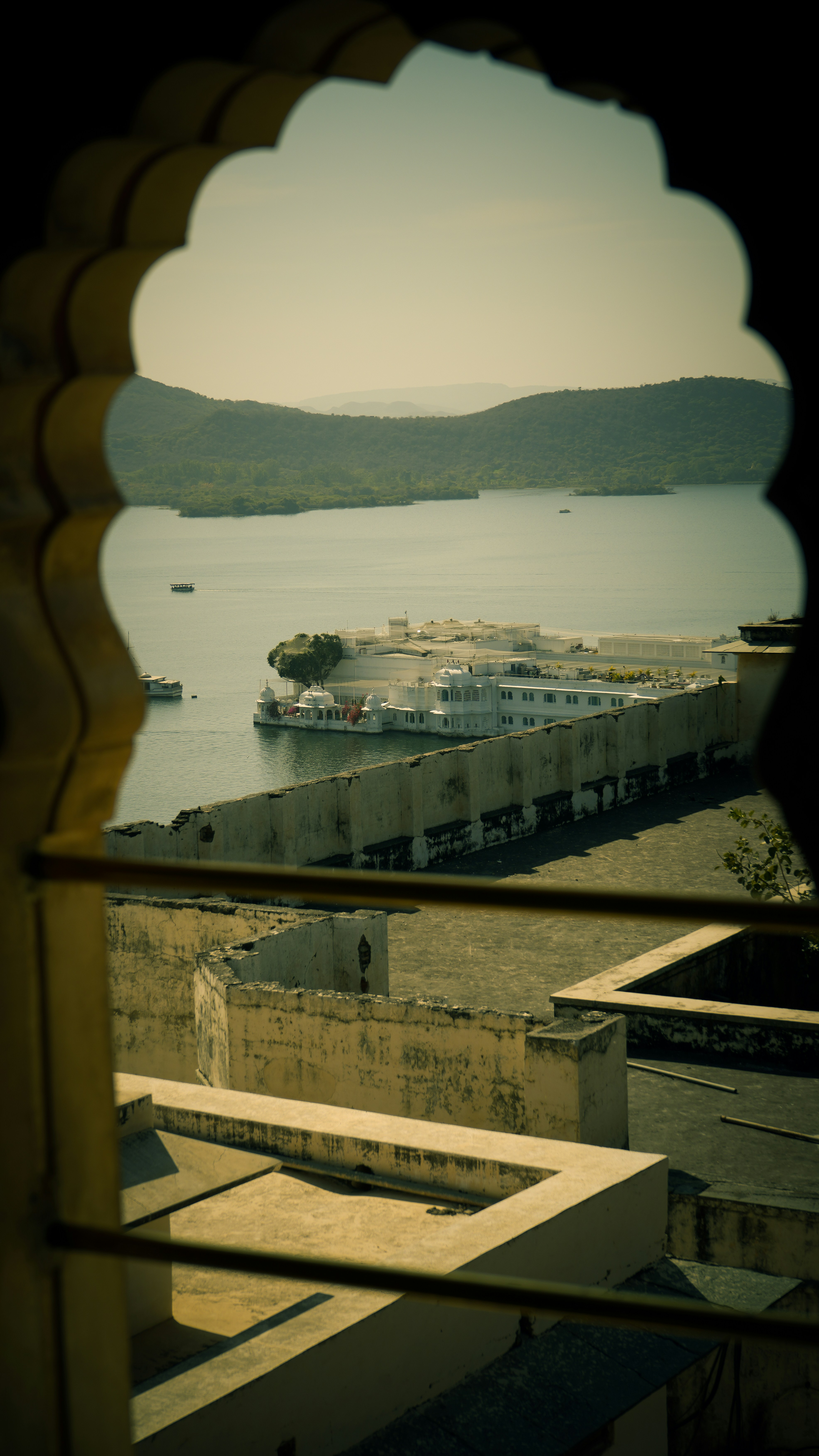 Framed Horizon: A Serene Port Through a Lattice Arch