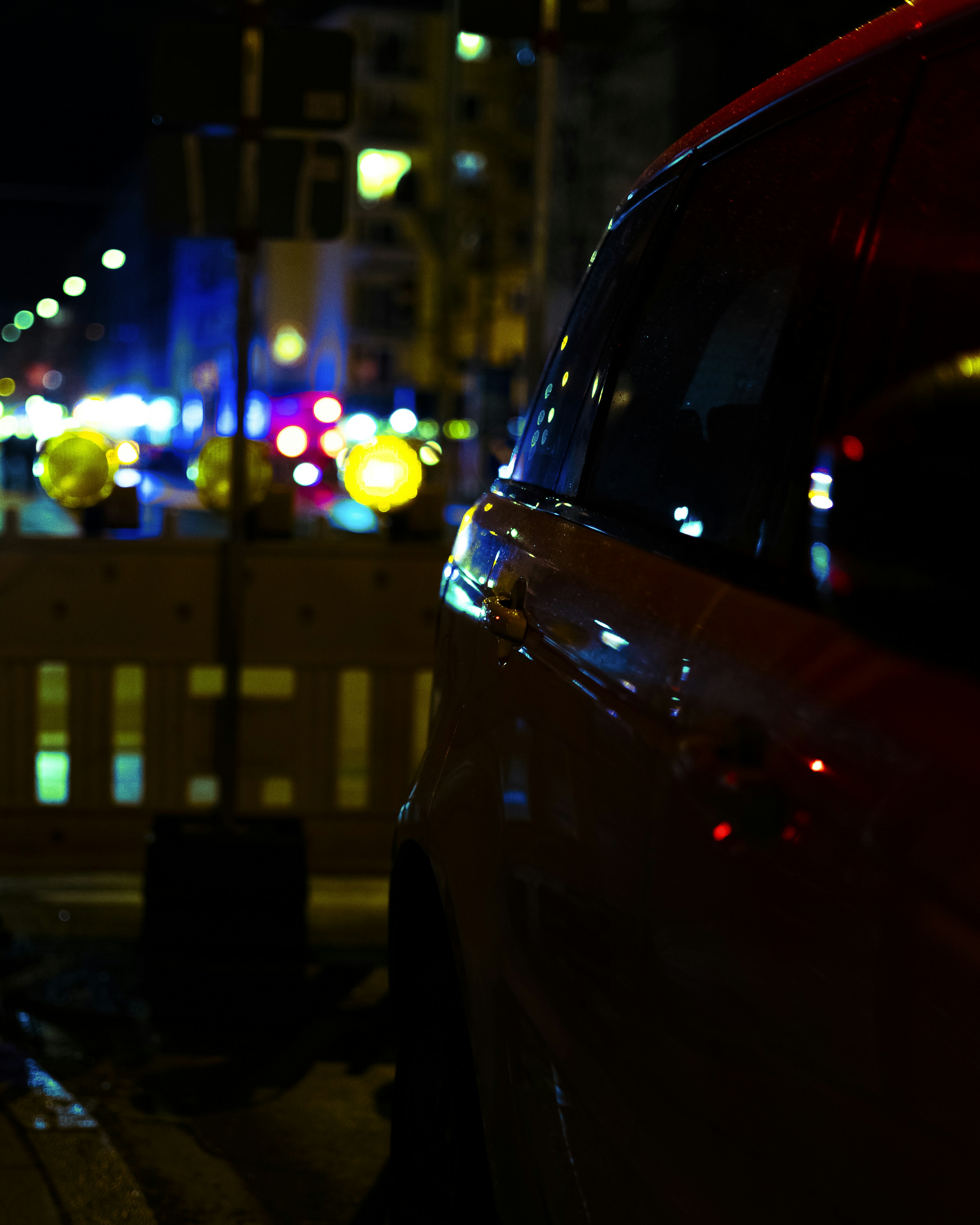 Urban Night Glints Reflected on a Quiet Van