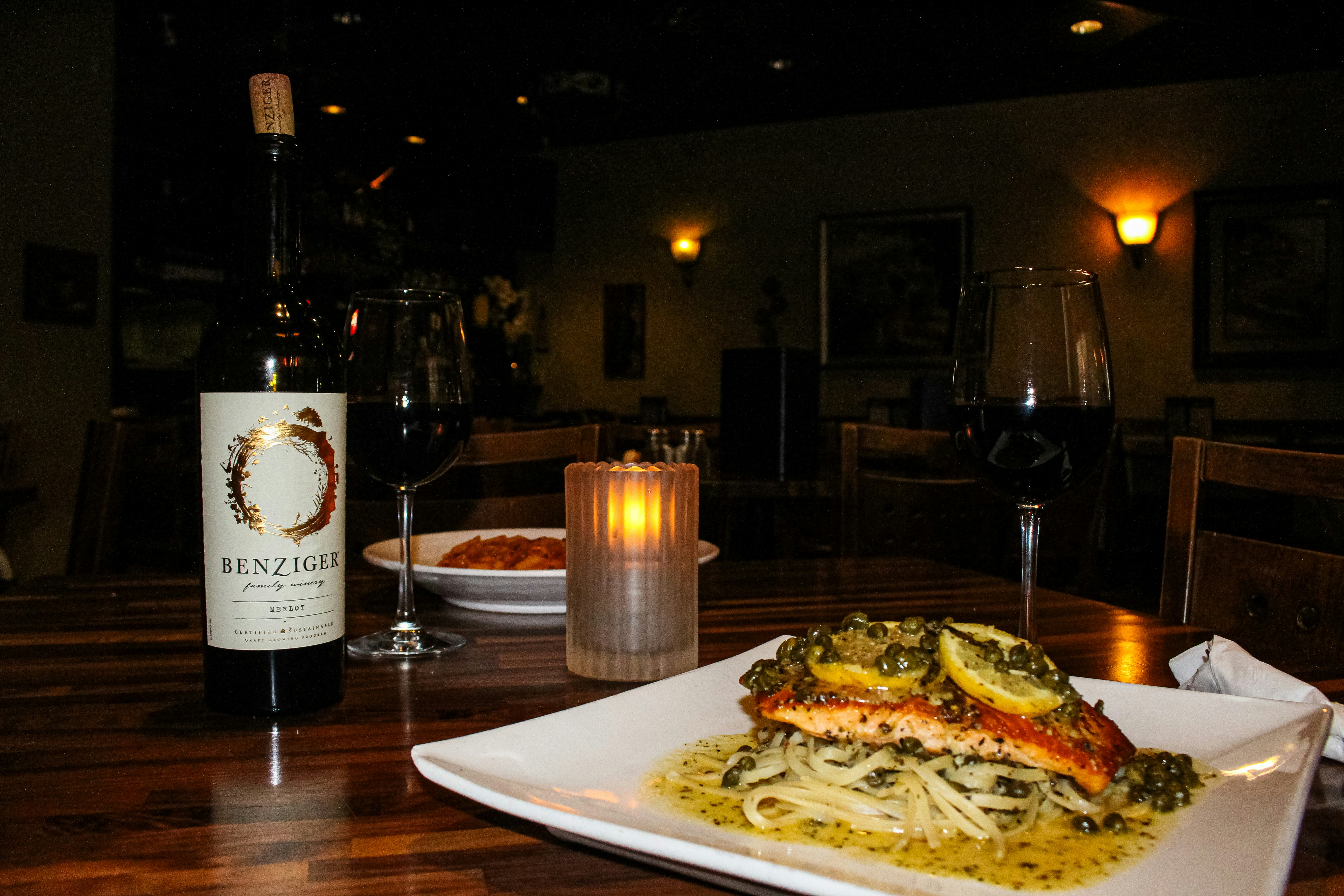 Drift of Olive Oil and Ambience: A Gourmet plated scene at a candlelit table