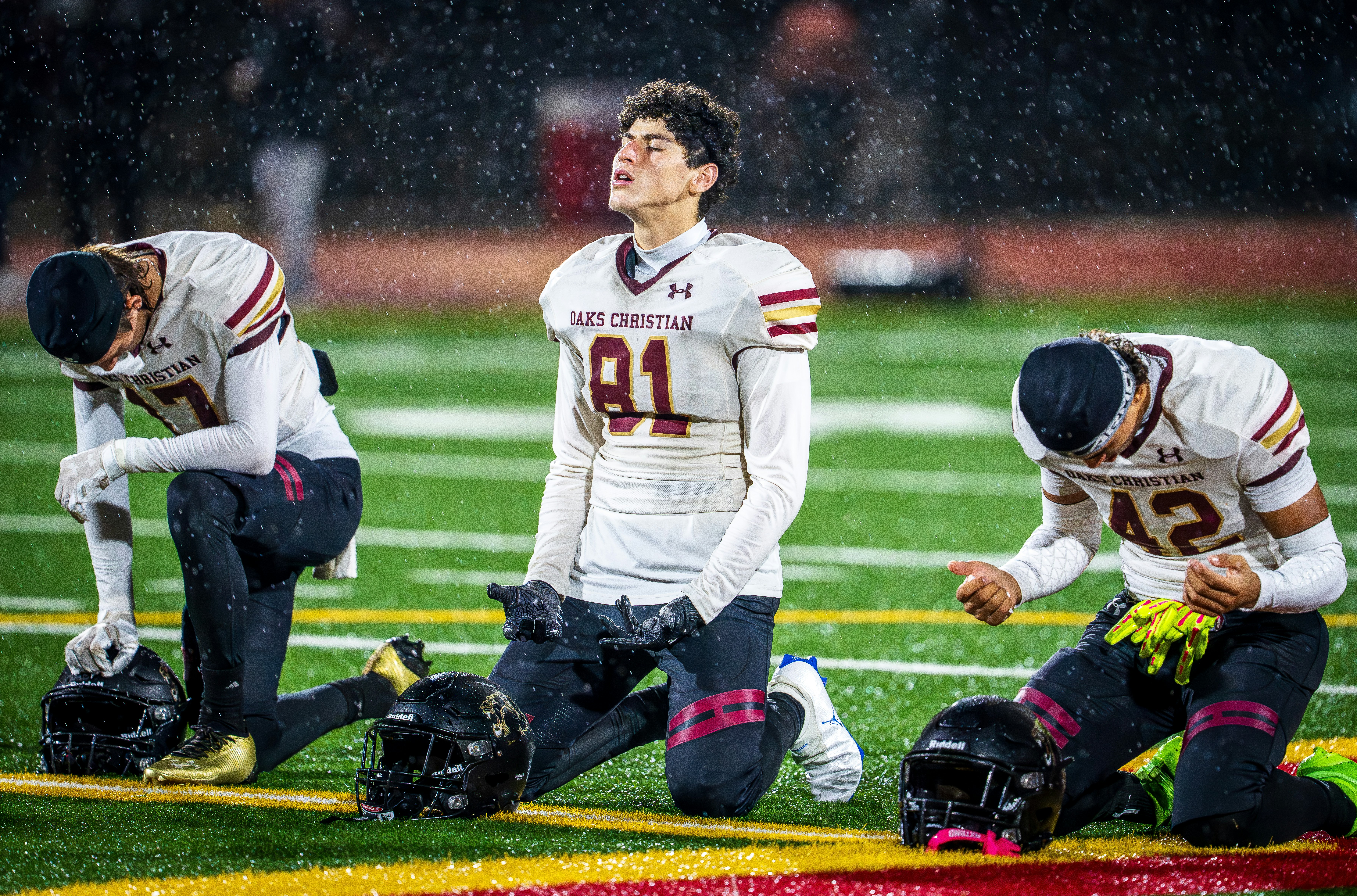 Kneeling in the Rain: A Moment of Resolve on the Field