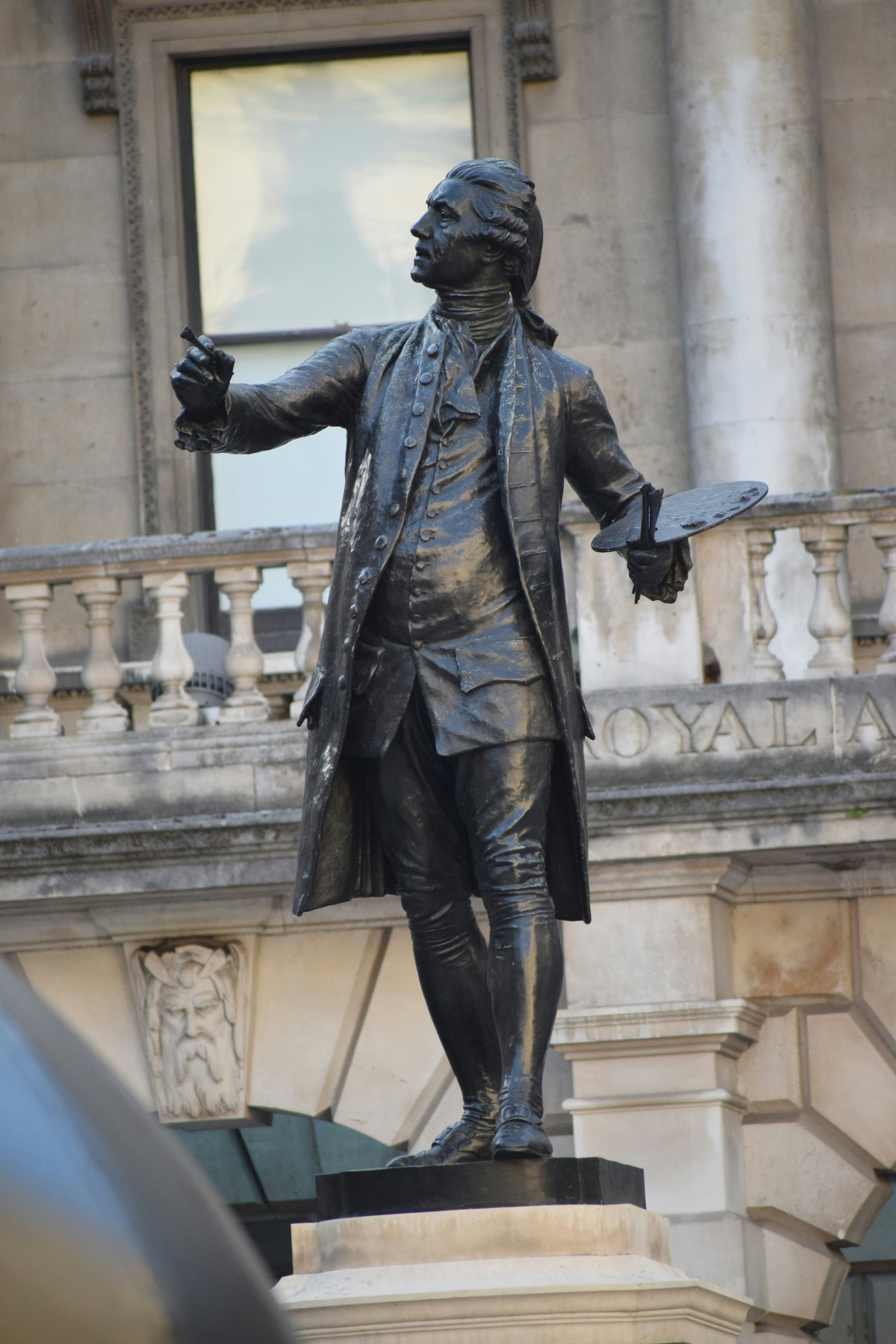 Statue of a Politician in a Historic City Hall Courtyard