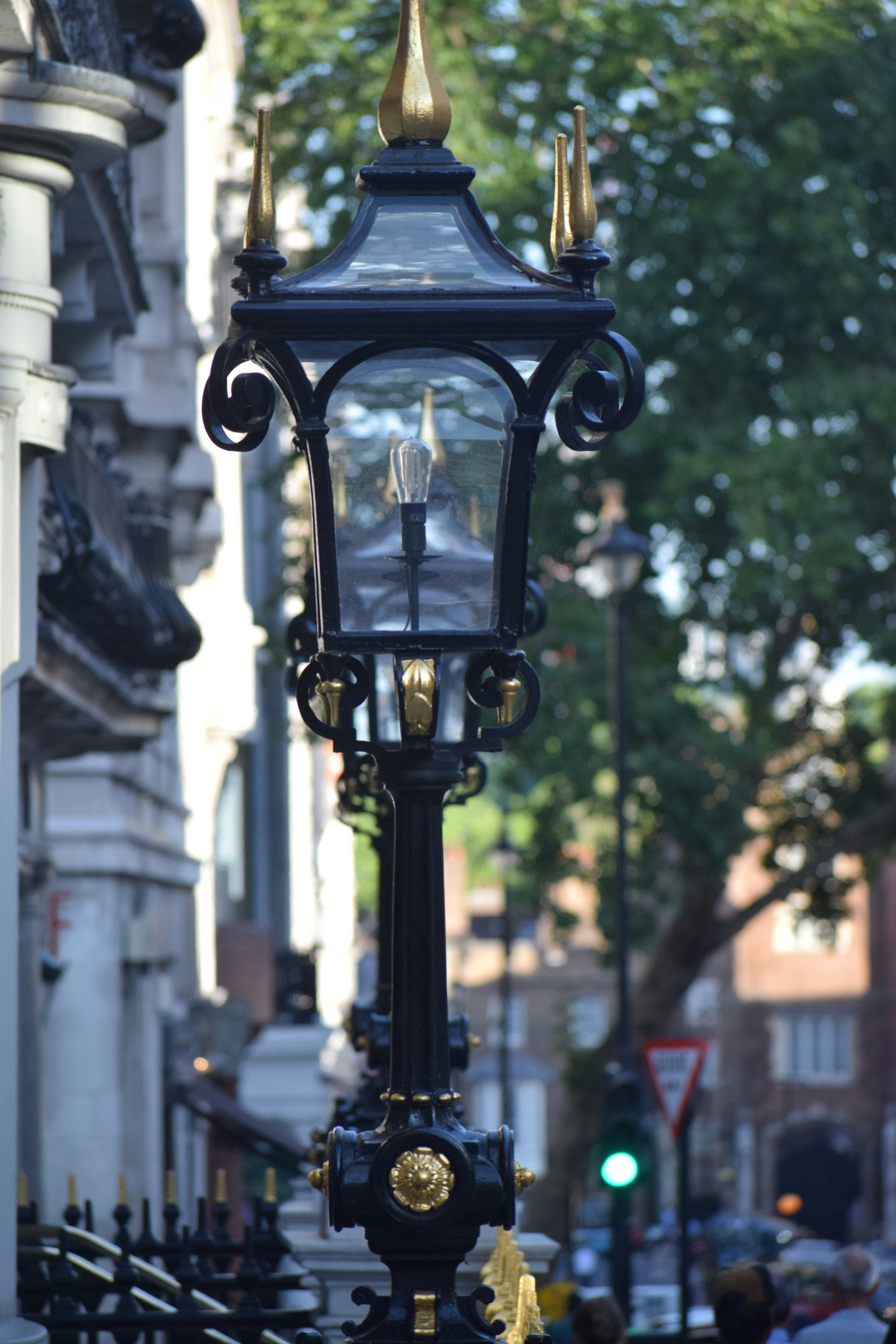 Ornate Street Lantern Reigns Over a Quiet City Corner