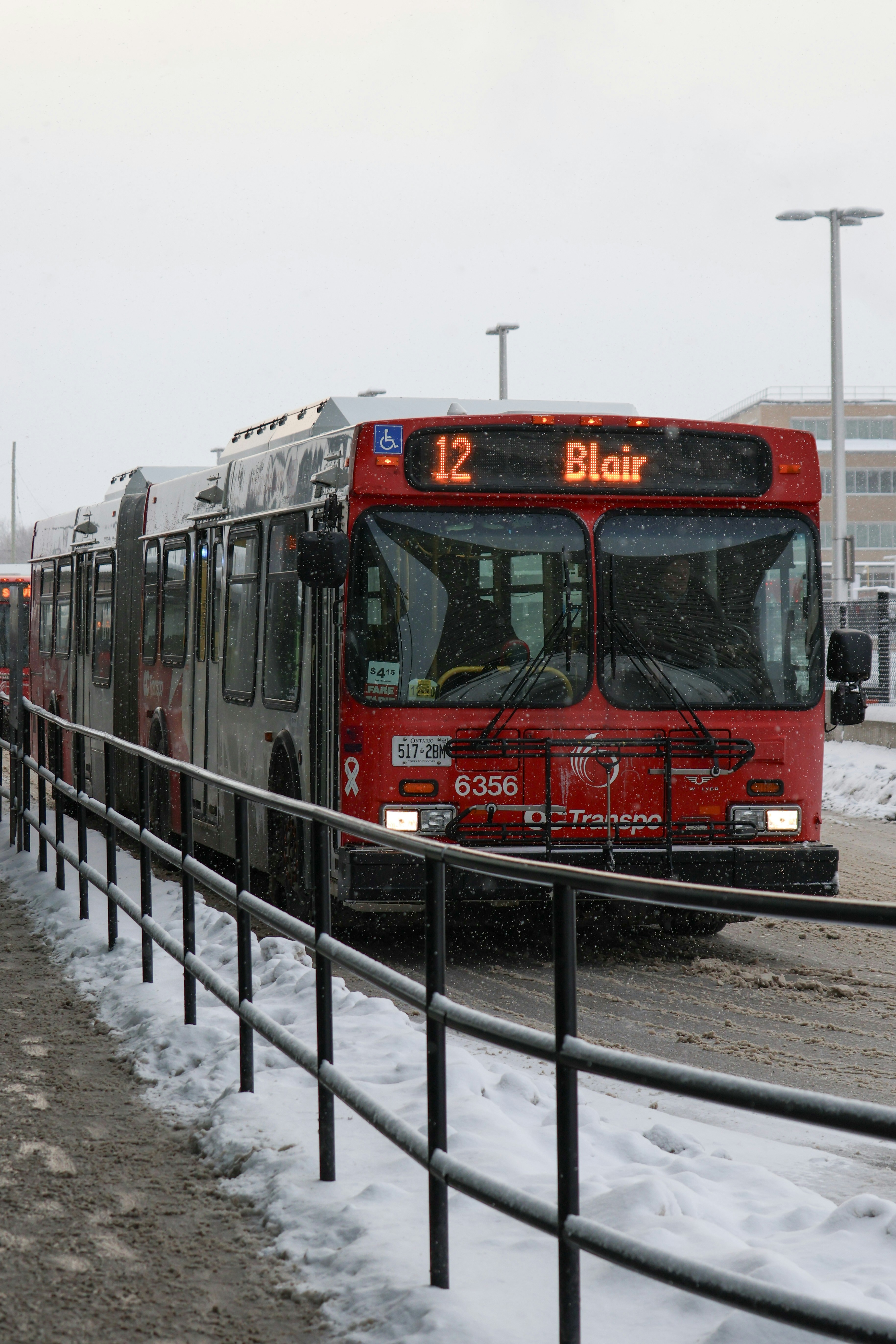 Red Transit Into Snowy Daylight