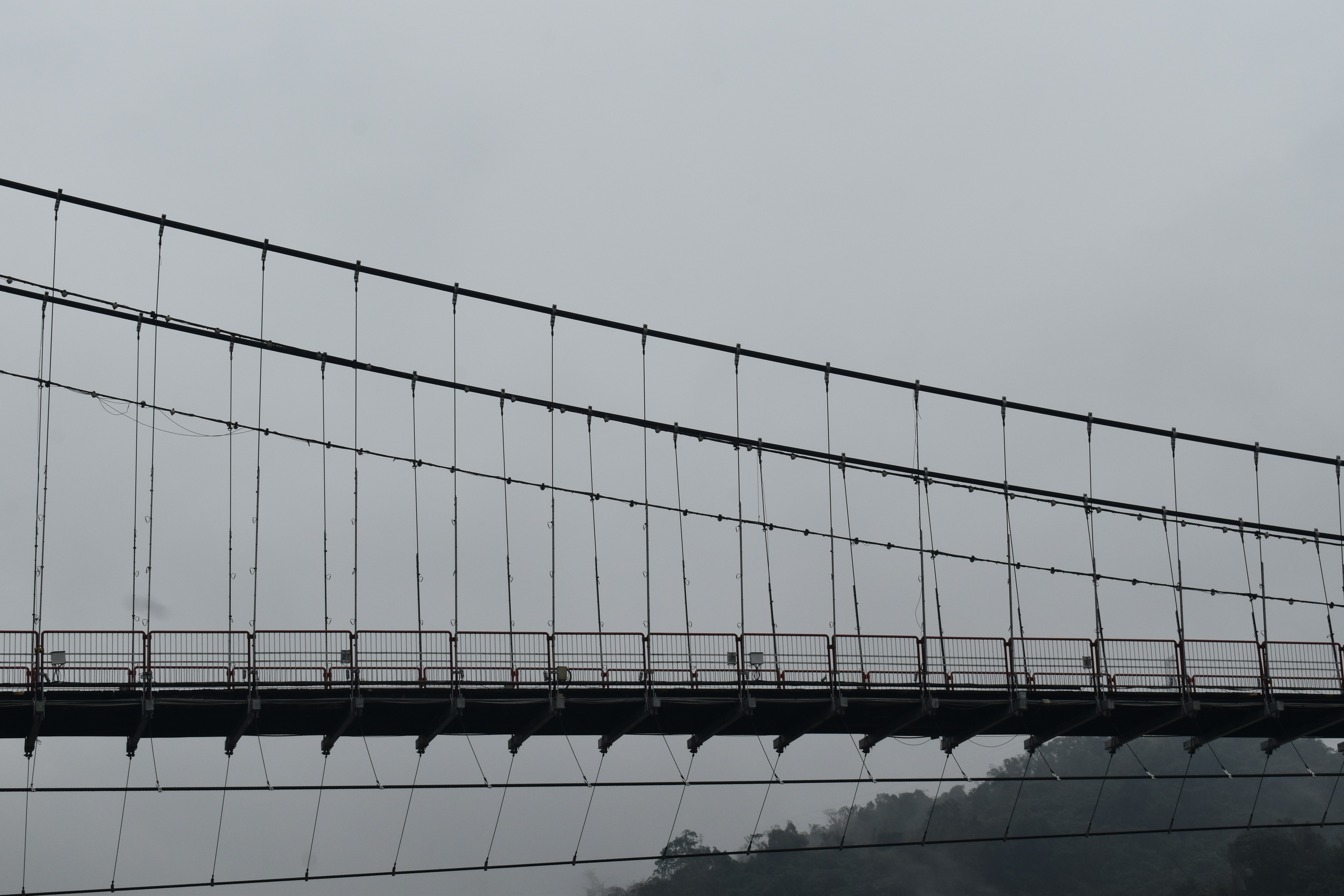 Suspended Lines: A Far-Reaching Bridge under a Quiet Sky