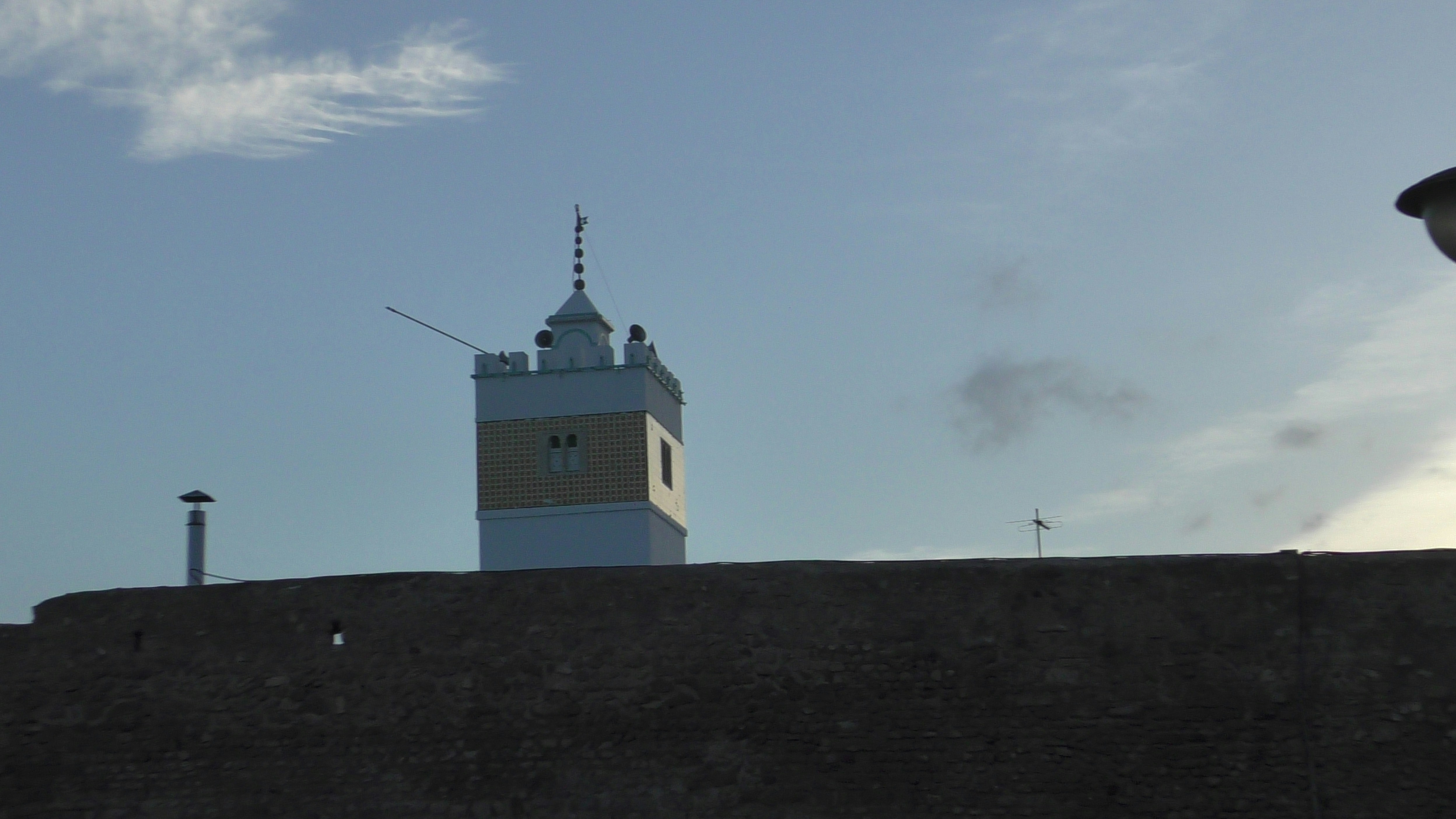 Watchtower on the Wall: a quiet skyline under a late-day blue