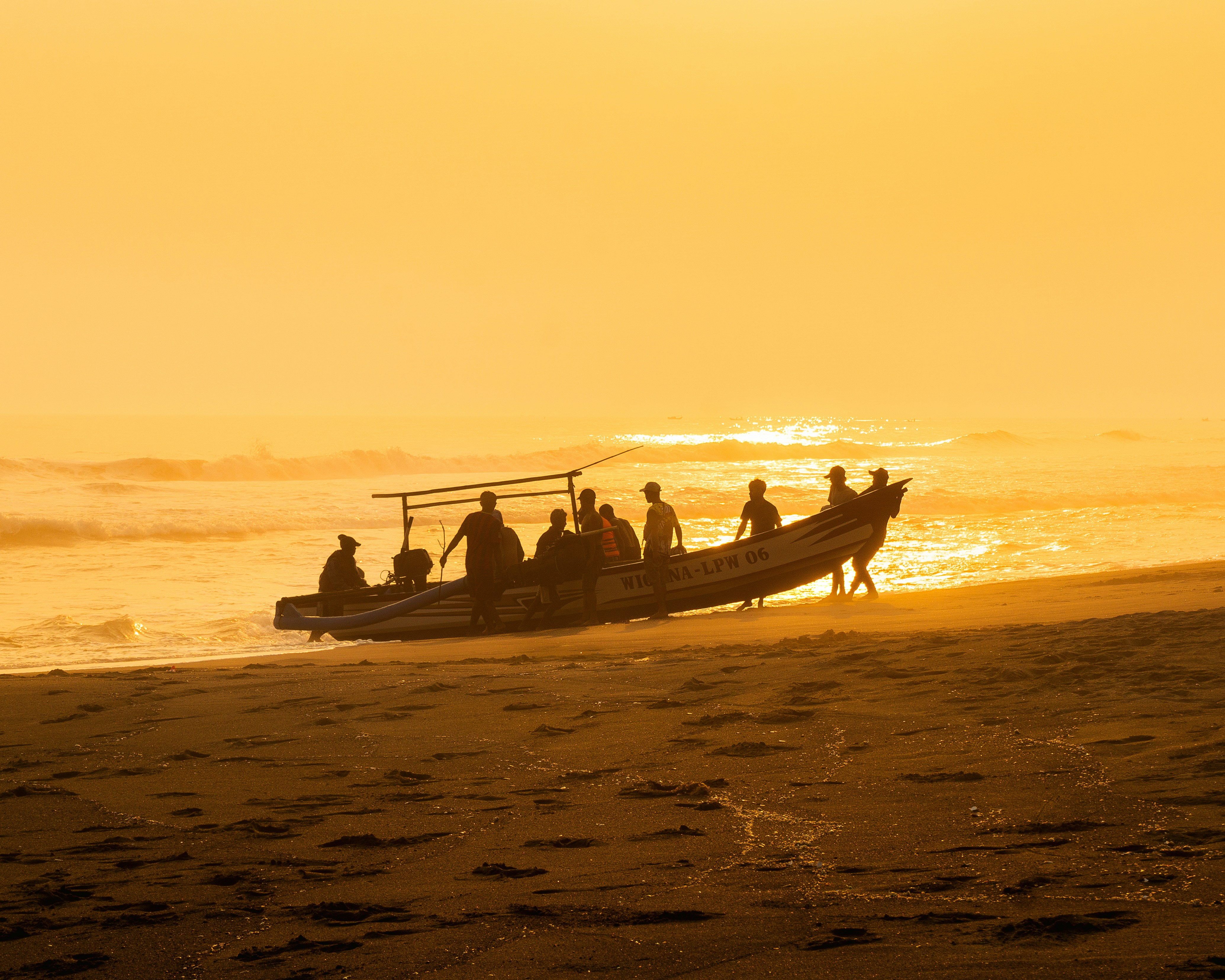 Amber Tide: Boats at Dusk on a Silhouetted Shore