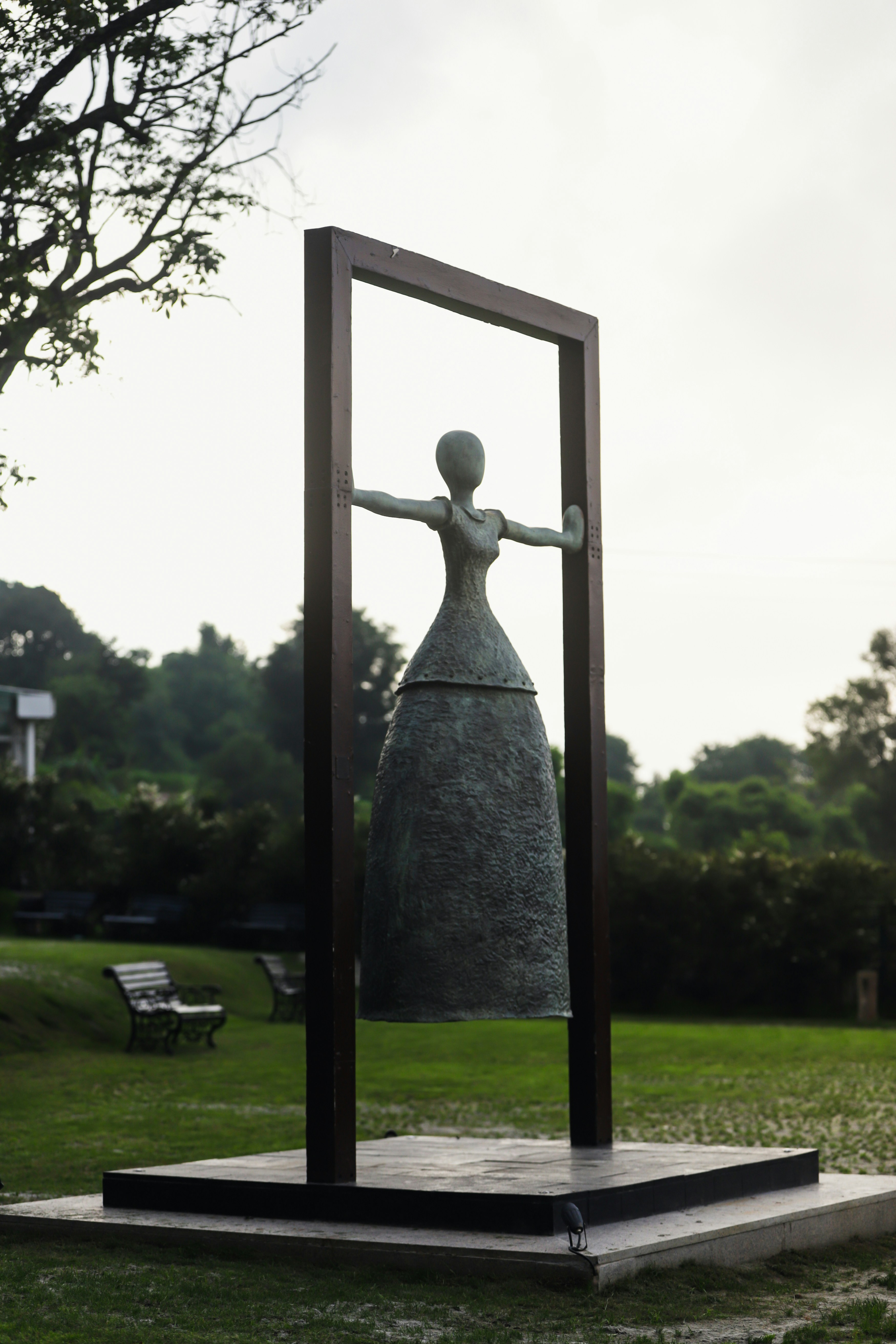 Frame Within Frame: A Silhouetted Figure Surrounded by Open Landscape